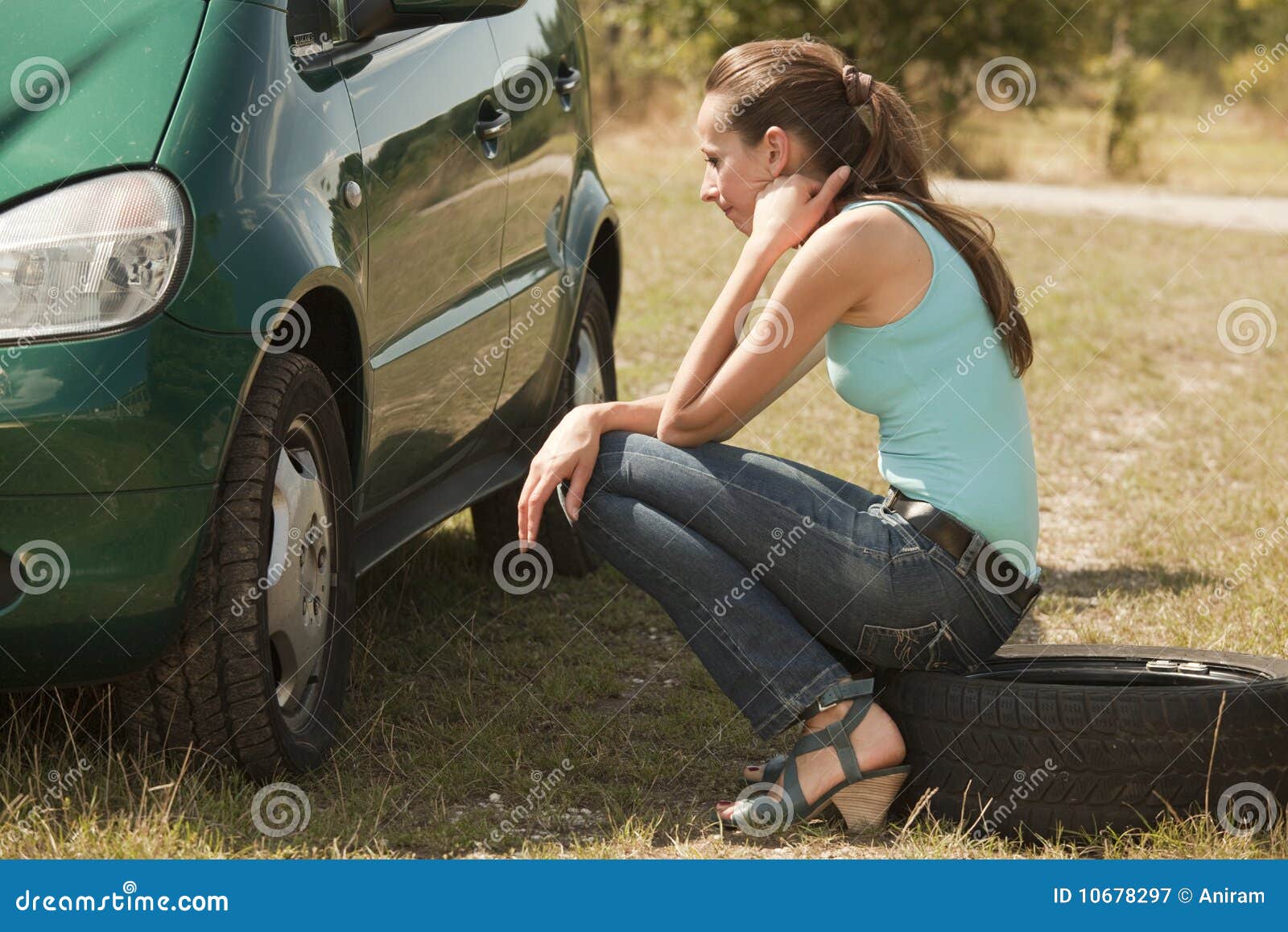 Sad woman sitting on tire stock image. Image of worries - 10678297