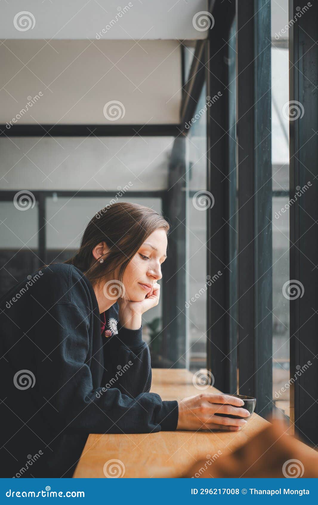 Sad Woman Sitting by the Window Looking Outside Stock Photo - Image of ...
