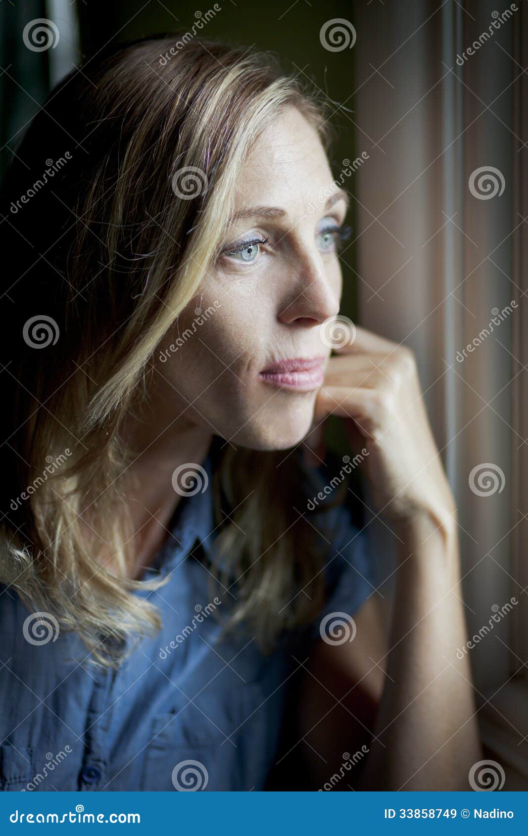 Sad Woman at the Window stock image. Image of closeup - 33858749