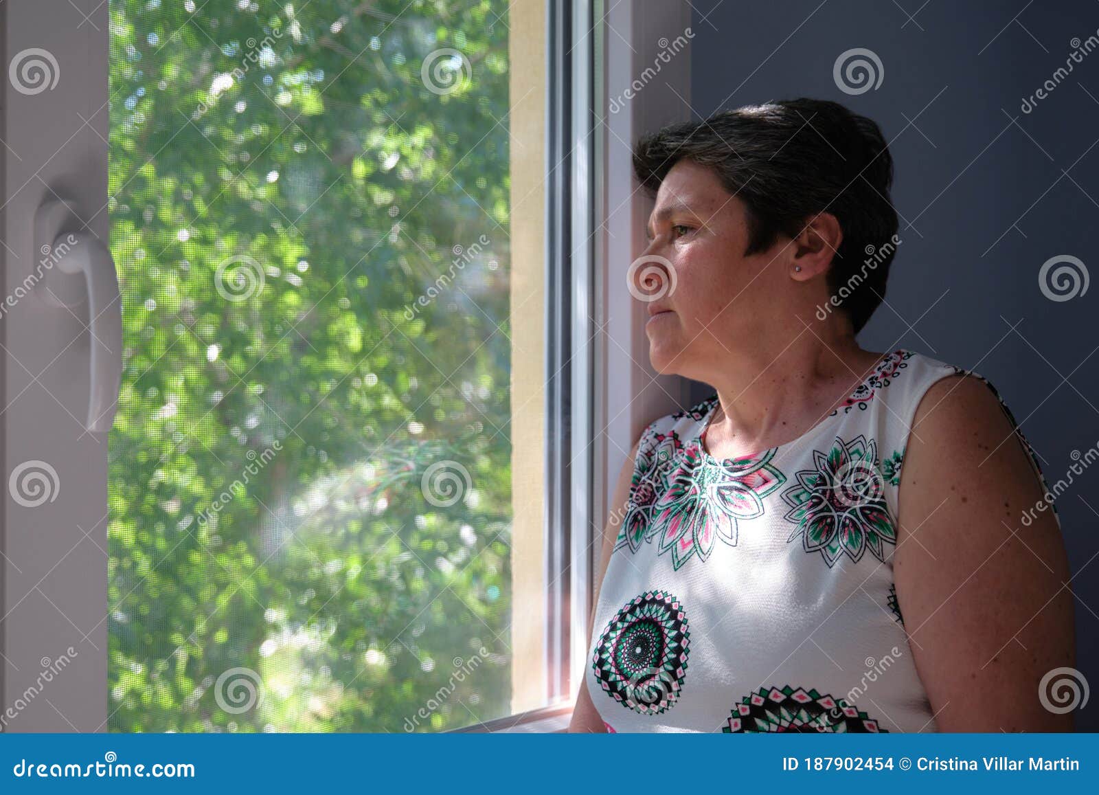 Sad Worried Thoughtful Mature Woman Looking Through The Window Stock