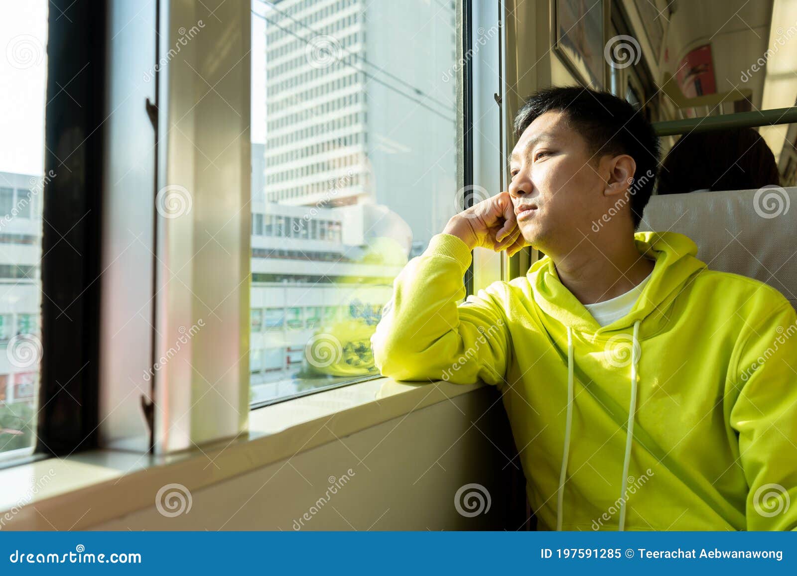 Sad Young Asian Man Looking through the Window in the Train Carriage ...