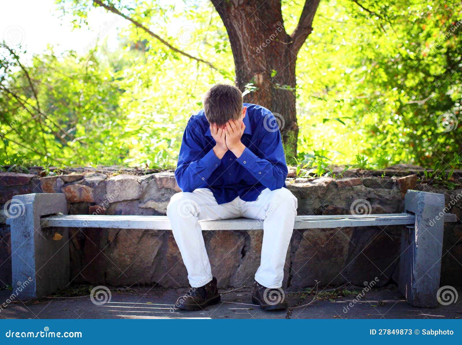 Sad Young Man stock image. Image of pose, bench, shirt - 27849873
