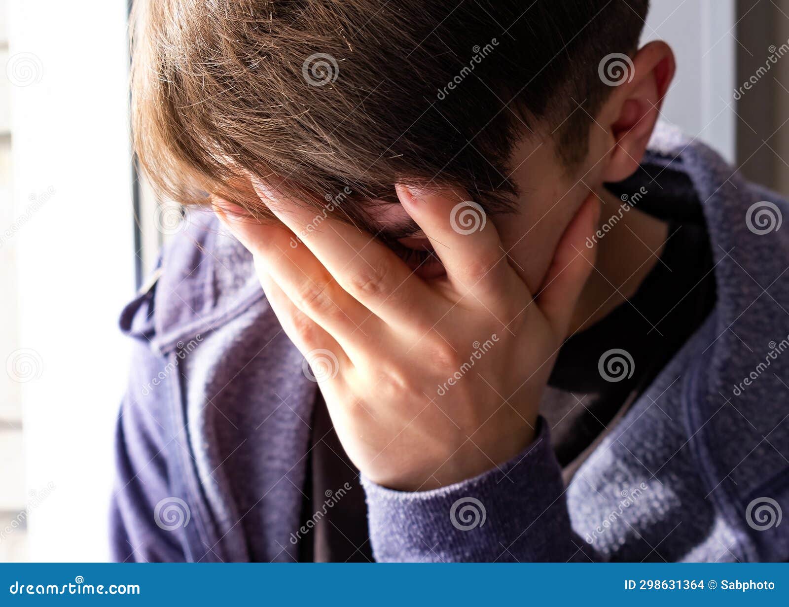 Sad Young Man stock photo. Image of sorrow, face, desolation - 298631364