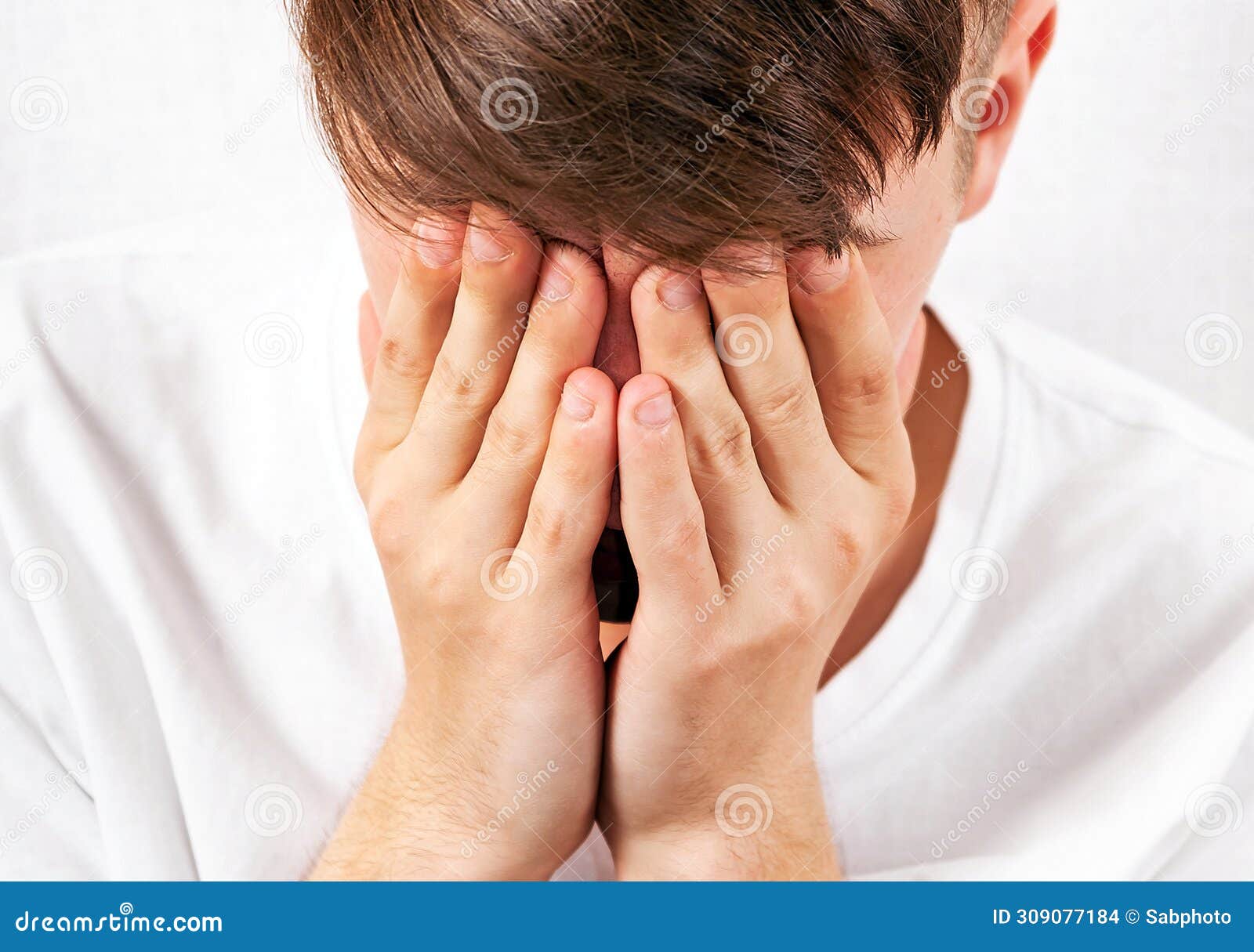 Sad Young Man is Crying stock photo. Image of alone - 309077184