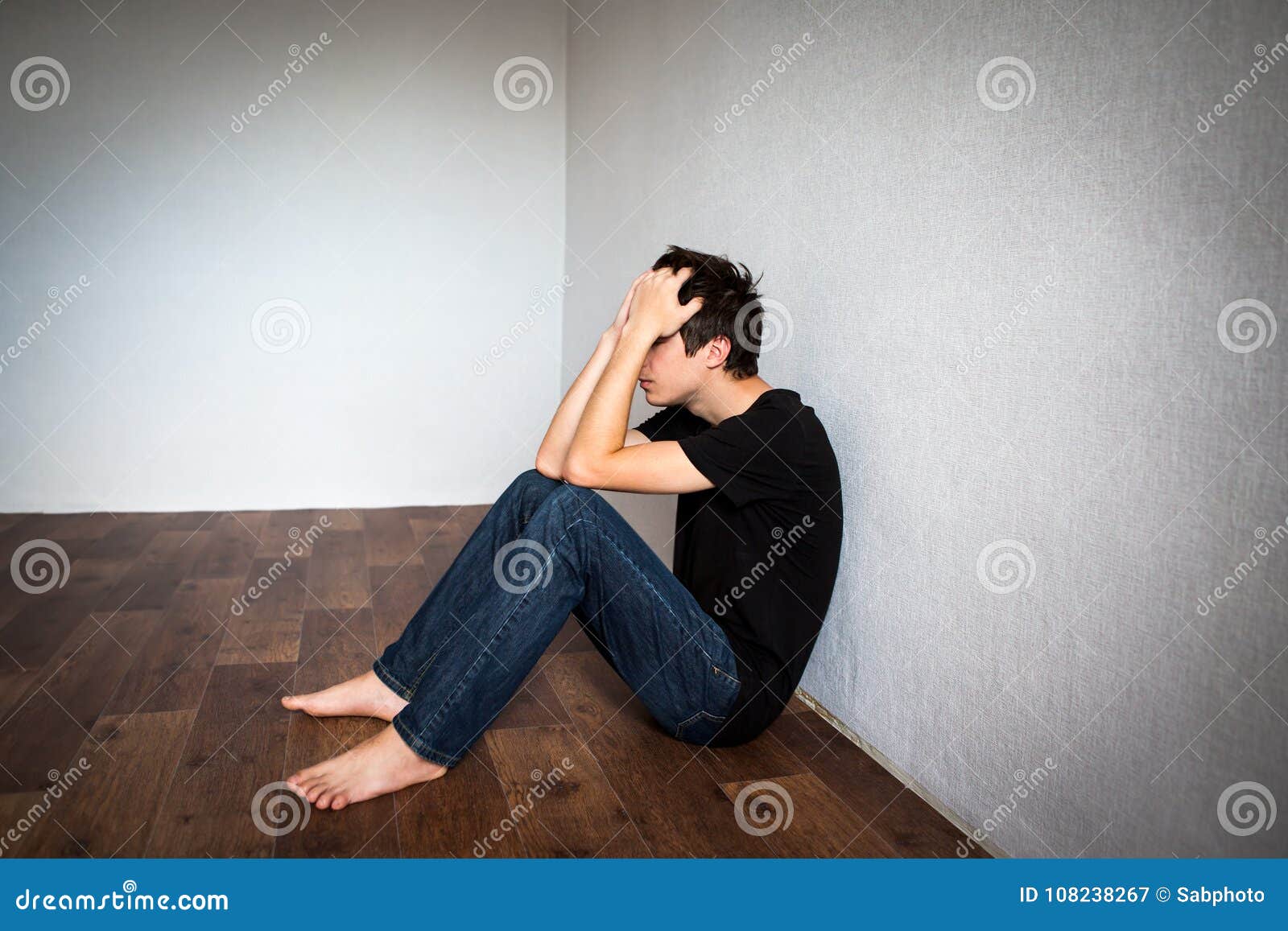 Sad Young Man stock image. Image of distress, flooring - 108238267