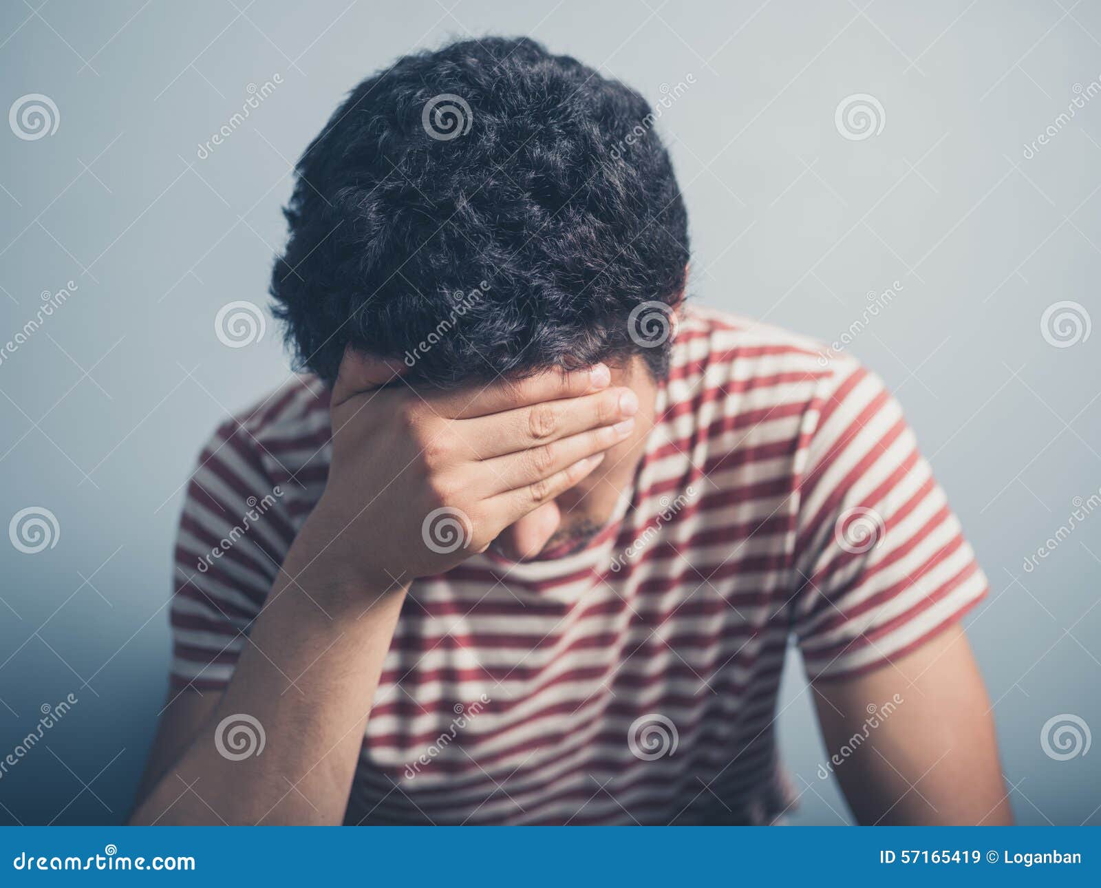 Sad Young Man with Hand on Forehead Stock Image - Image of person ...