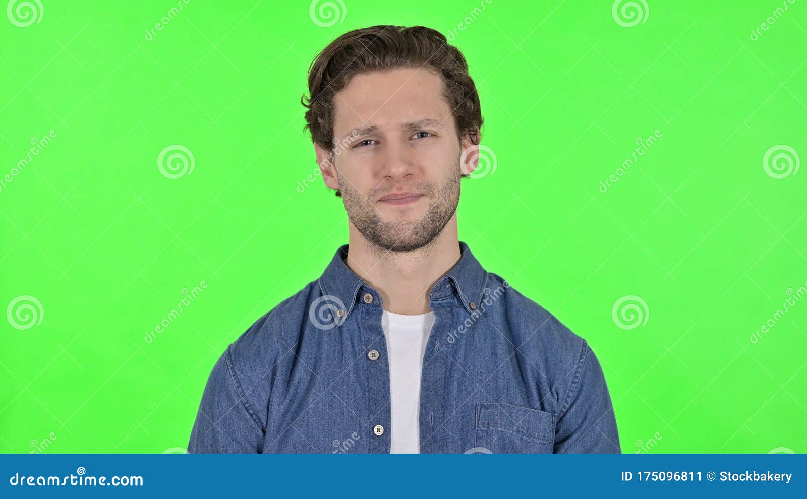 Sad Young Man Looking at the Camera on Green Chroma Key Stock Image ...