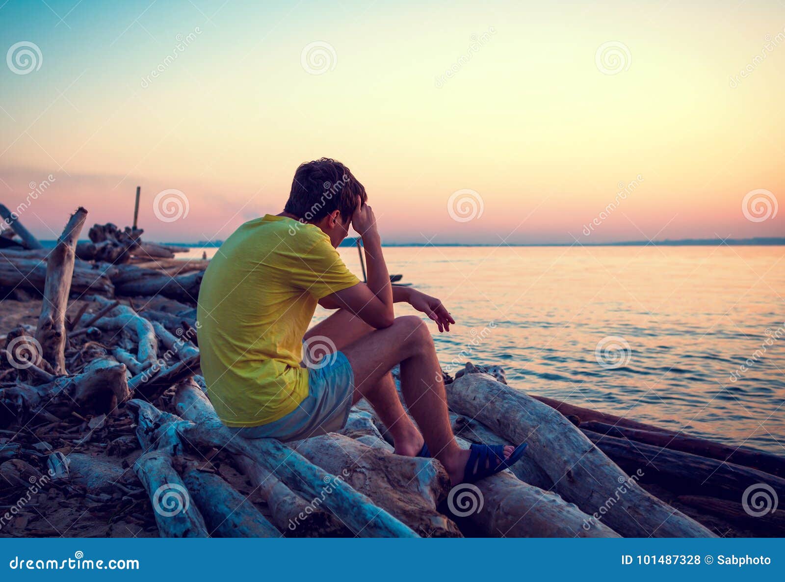 Sad Young Man outdoor stock photo. Image of evening - 101487328