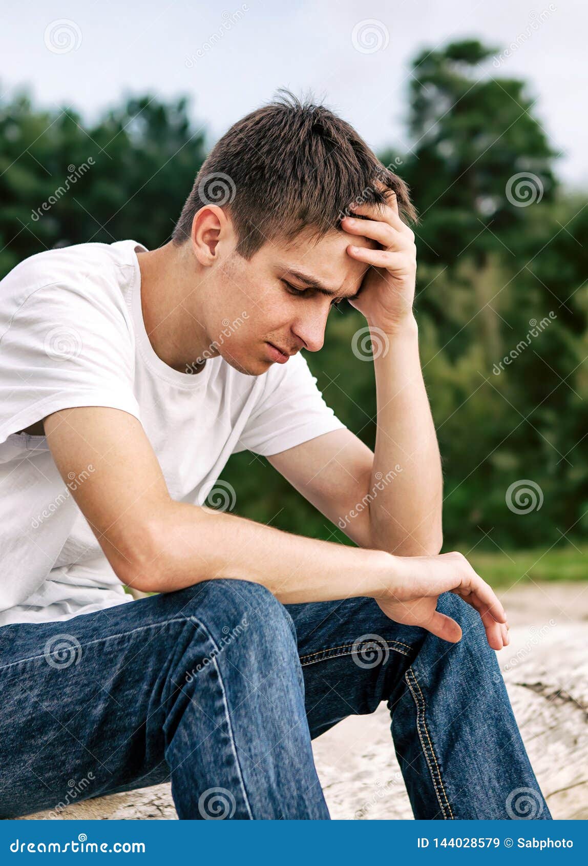 Sad Young Man outdoor stock image. Image of alone, forest - 144028579