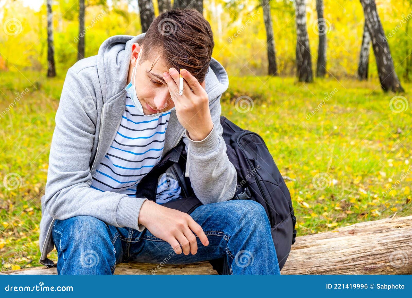 Sad Young Man stock photo. Image of problem, park, sorrowful - 221419996
