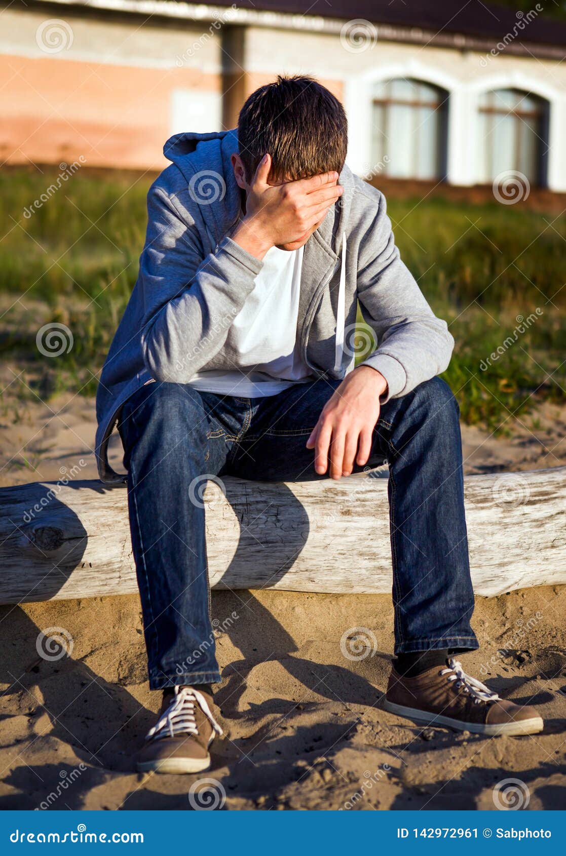 Sad Young Man stock image. Image of country, grass, street - 142972961