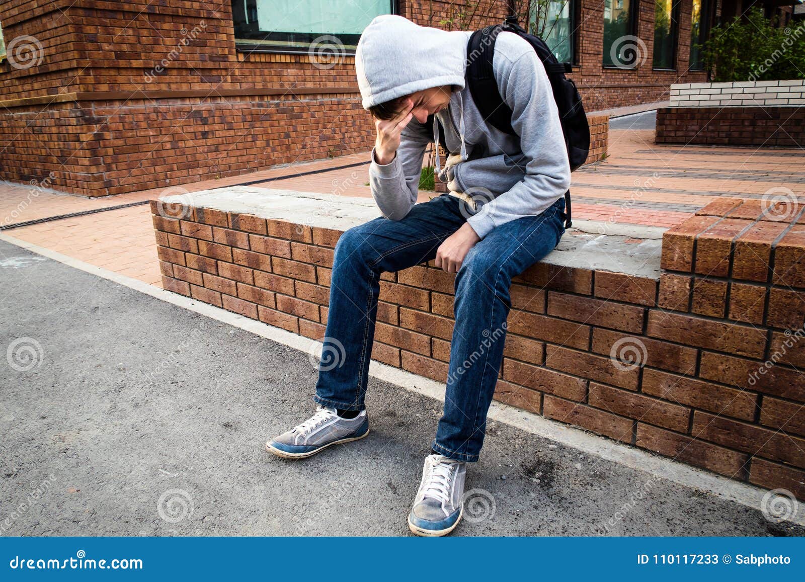 Sad Young Man stock image. Image of grass, outdoor, adult - 110117233