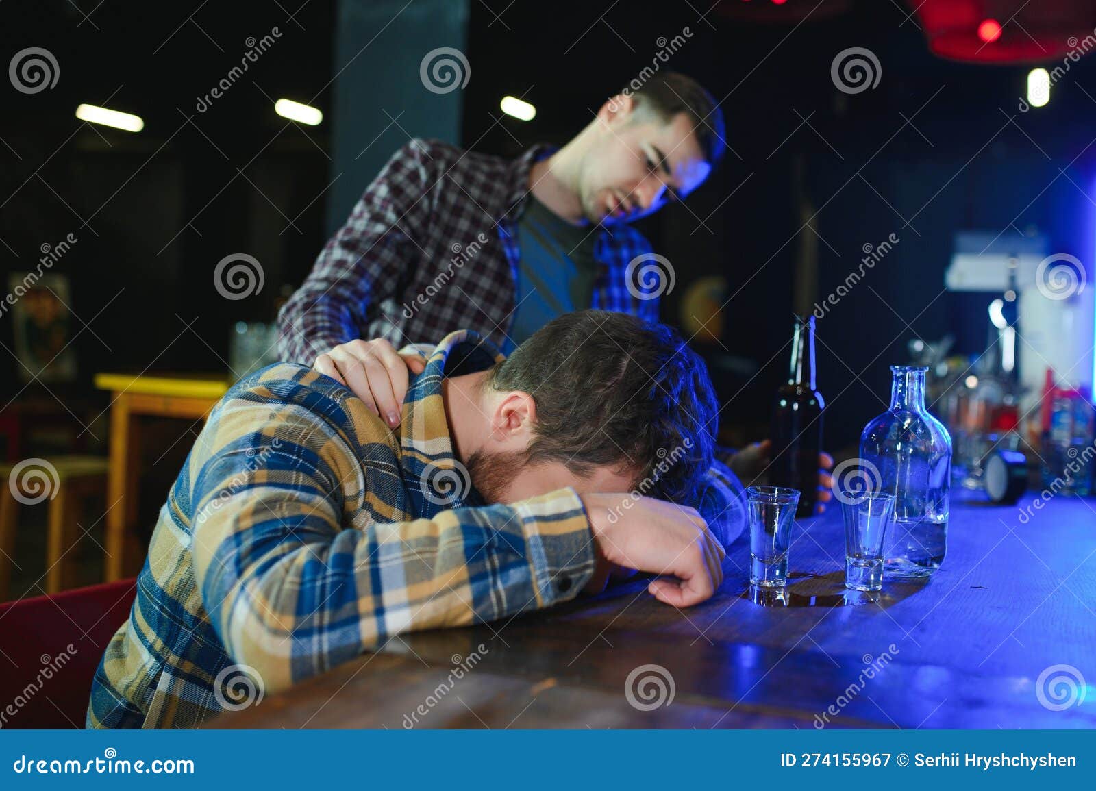 Sad Young Man Sitting at Bar Counter in Pub. Upset Man Drinks Alcohol ... Sad Young Man Sitting at Bar Counter in Pub. Upset Man Drinks Alcohol ...