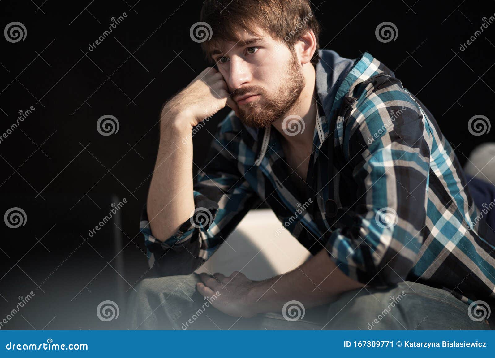 Sad Man Sitting on the Couch Looking into Space Stock Image - Image of ...
