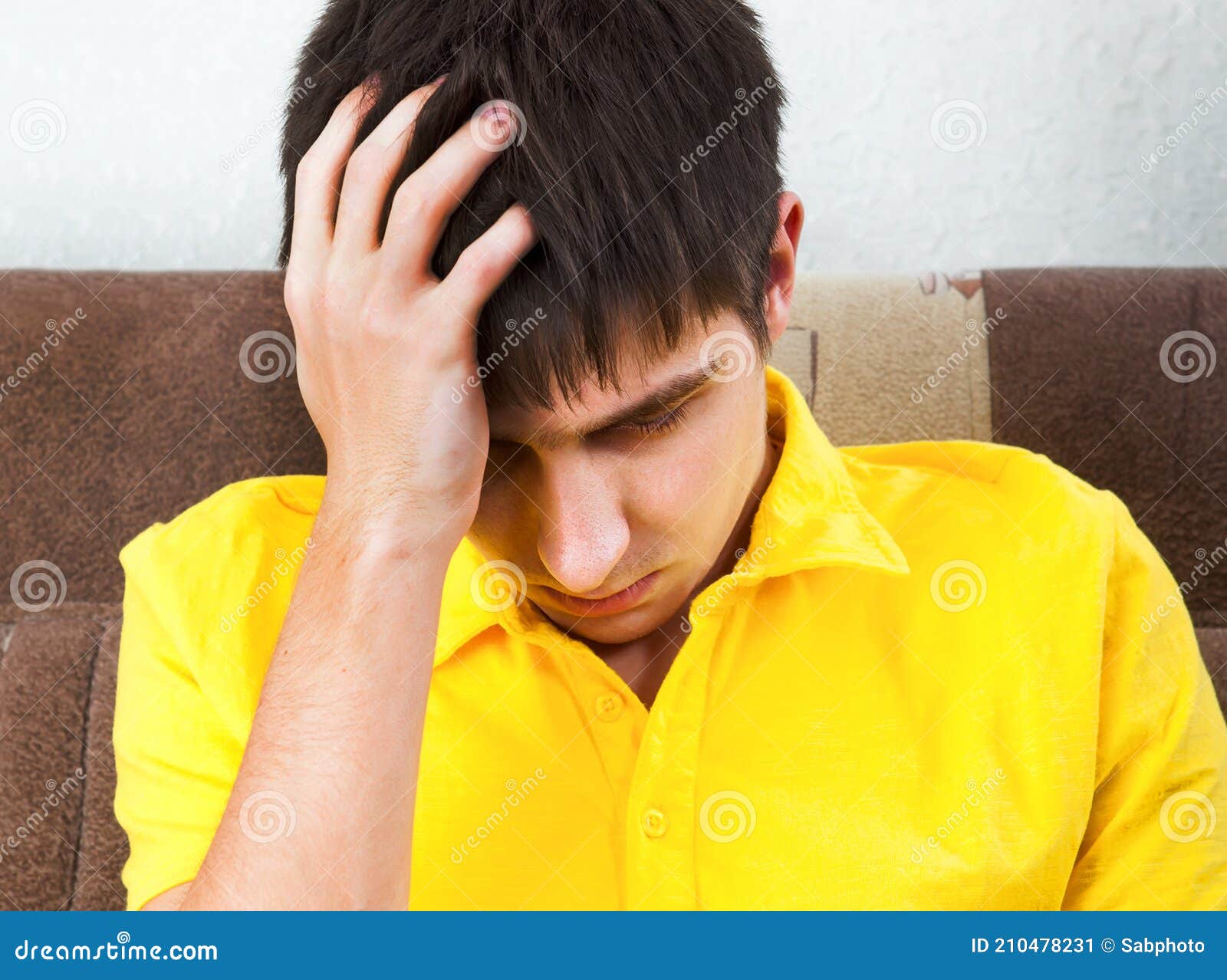 Sad Young Man stock image. Image of couch, desolation - 210478231