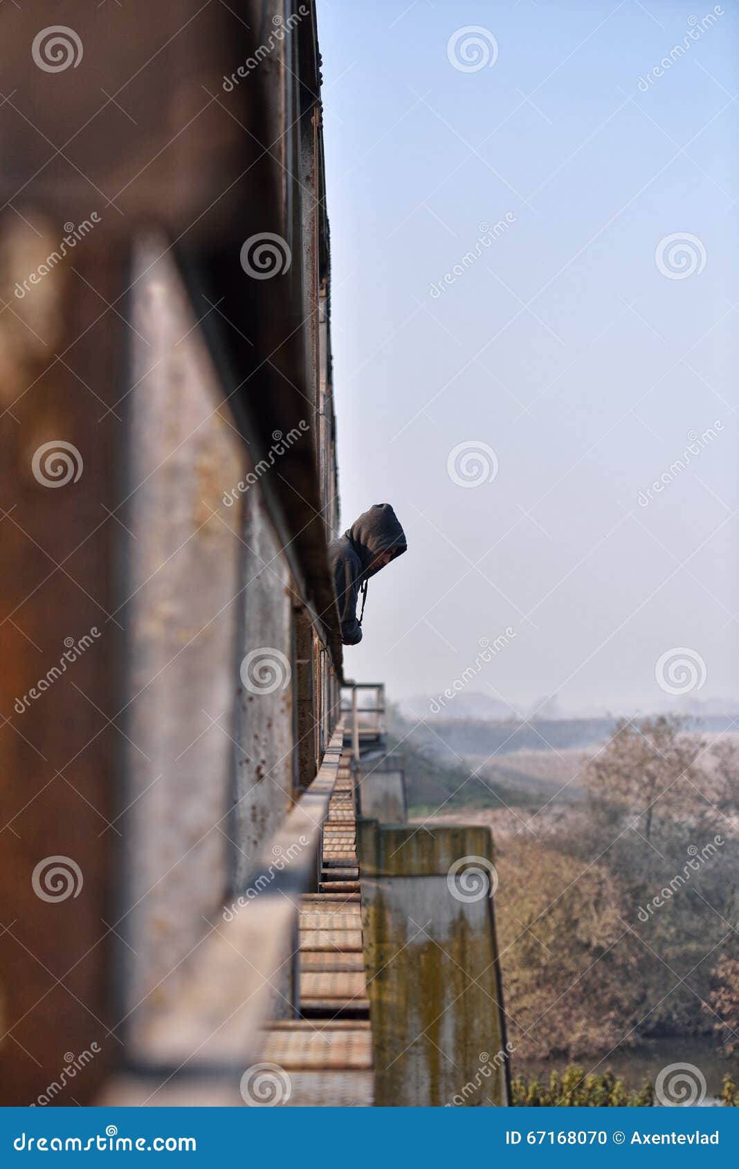 Sad Young Man Standing on the Edge of Bridge. Looking Away Thi Stock ...
