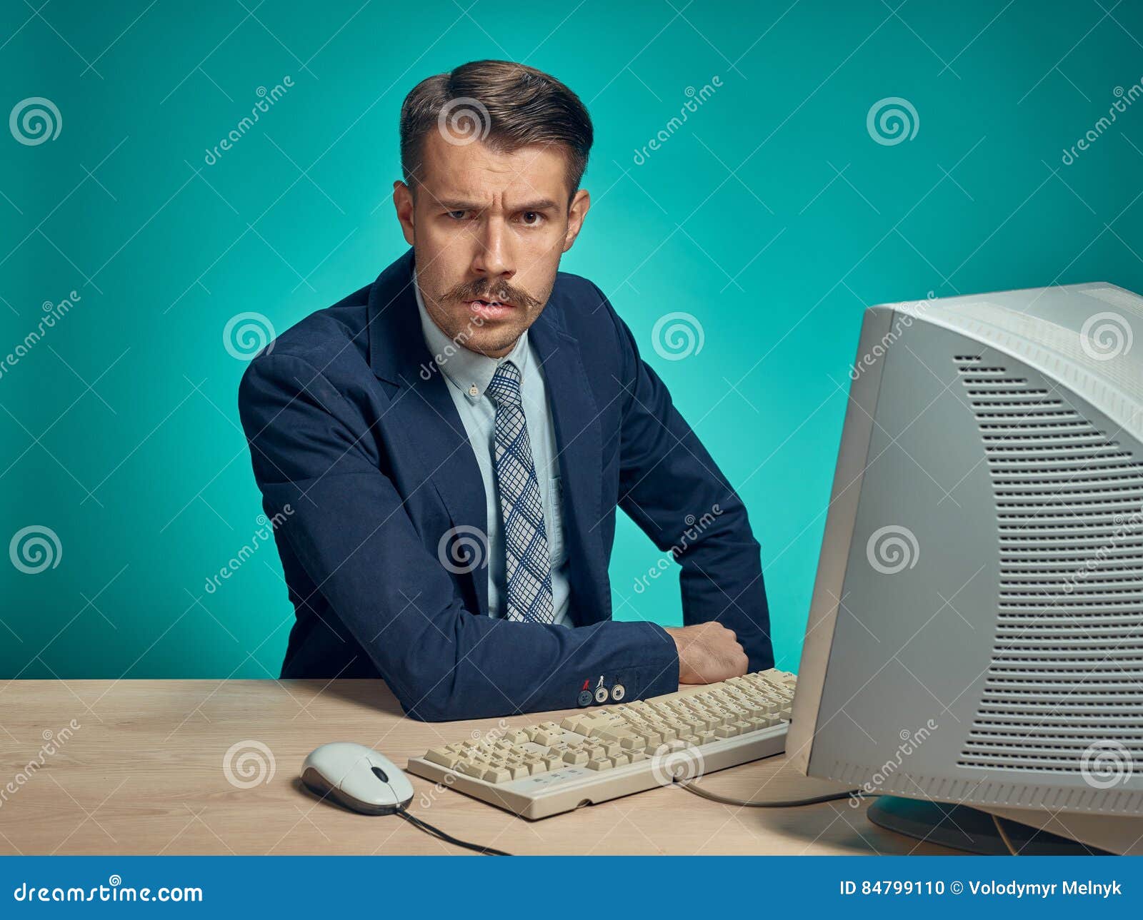 Sad Young Man Working on Computer at Desk Stock Photo - Image of ...