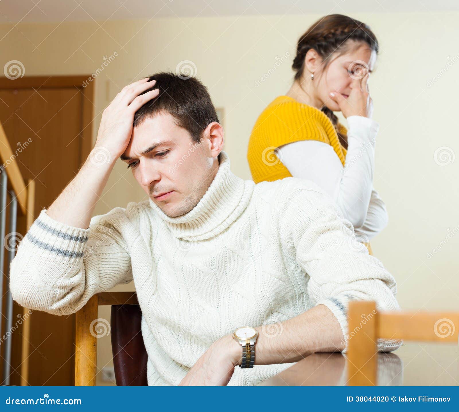 Sad Young Ordinary Man and Crying Woman at Home Stock Photo - Image of ...