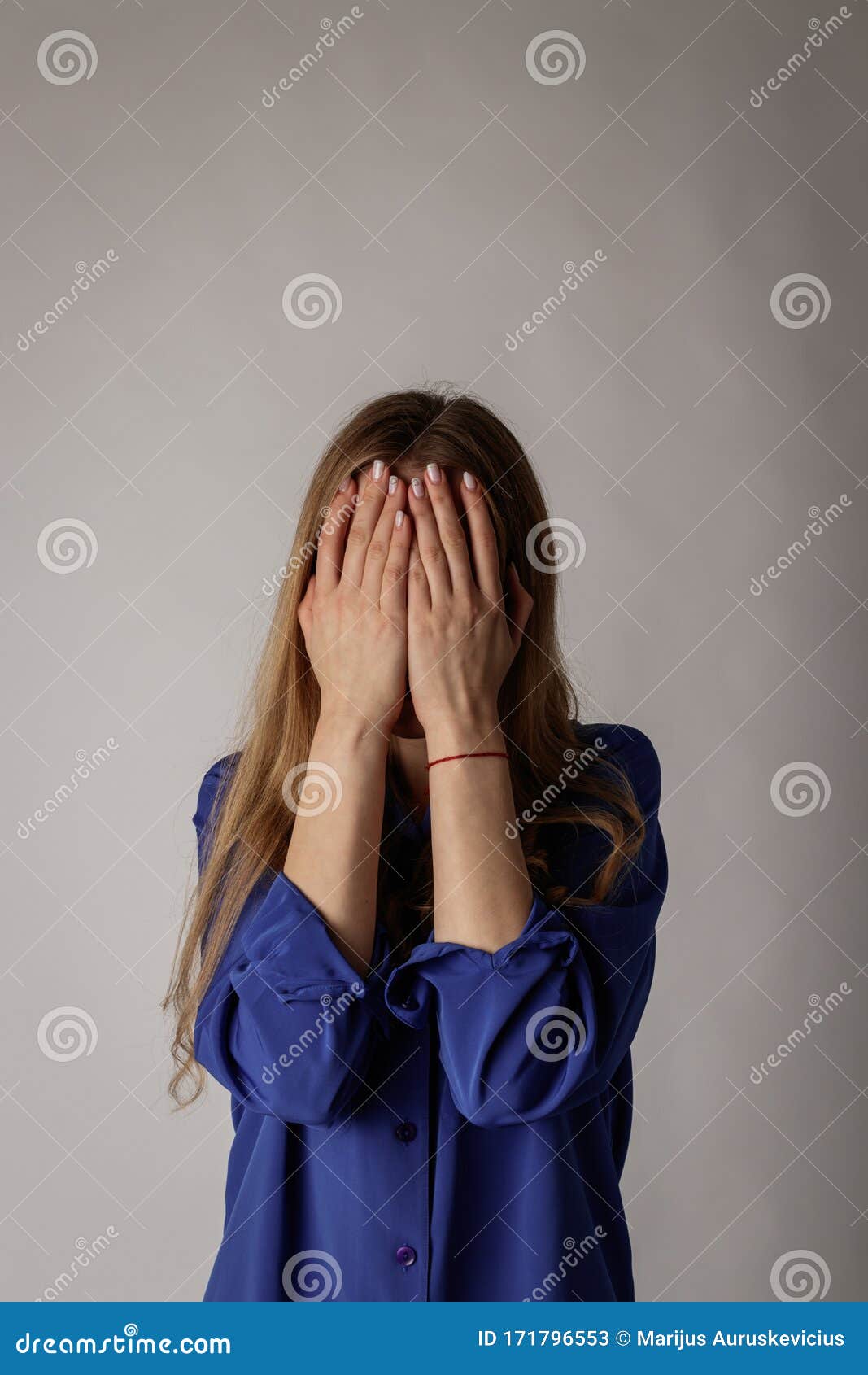 Sad young woman in blue stock image. Image of melancholy - 171796553
