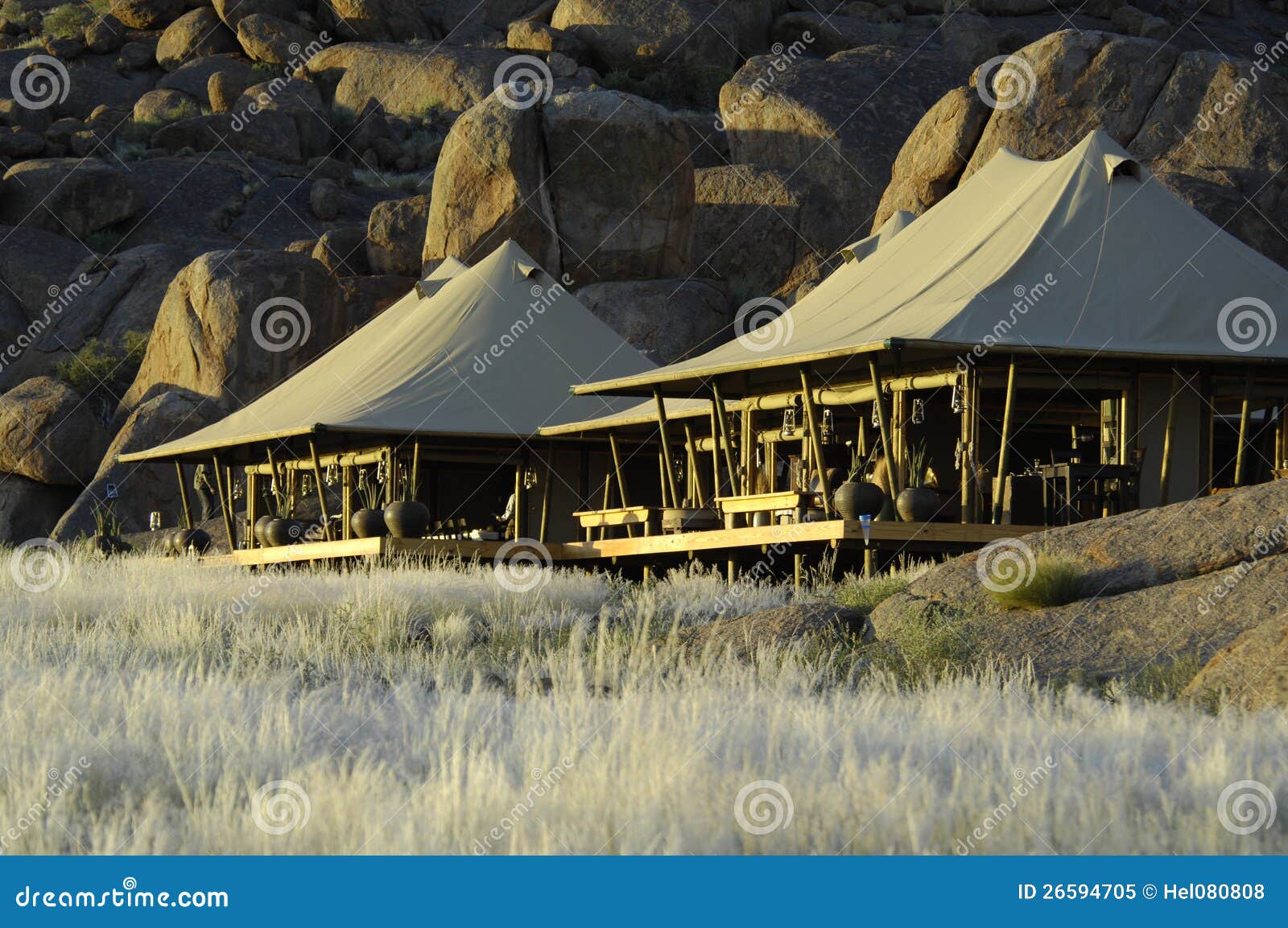 Safari Camp in Africa, Tents in Front of Huge Boulders. Luxury Safari ...