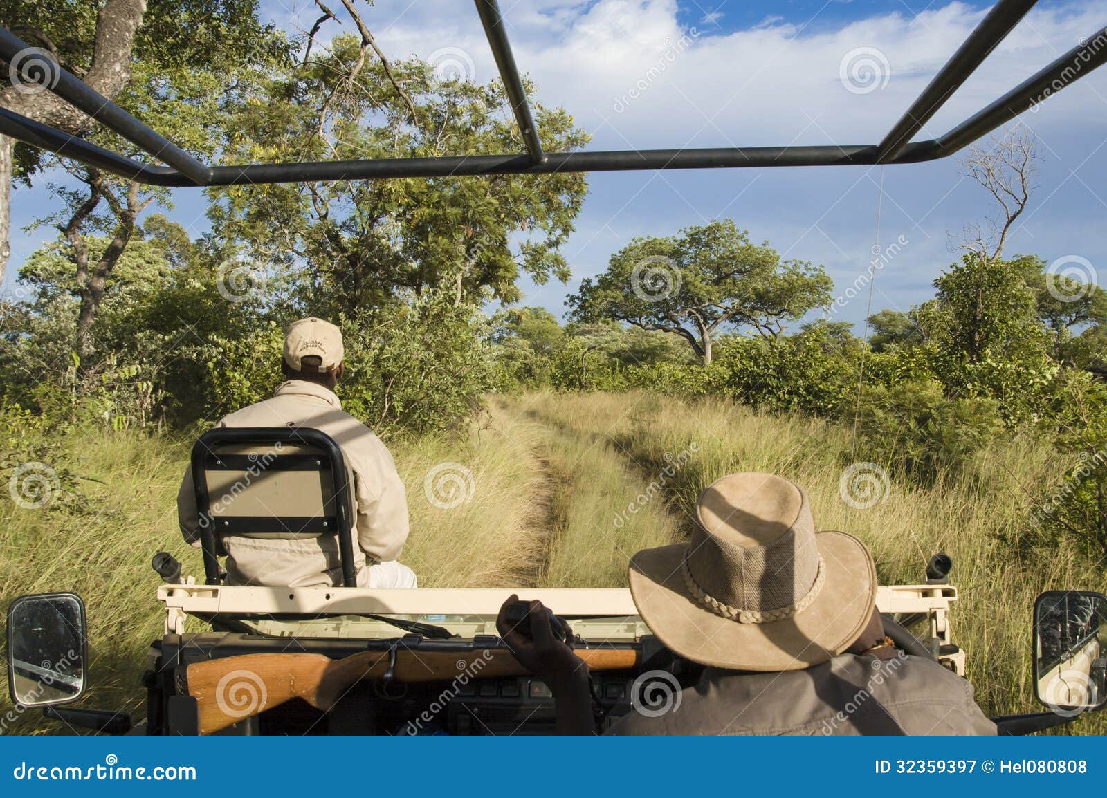 Safari Drive in Open Vehicle in South Africa. Ranger Looking for ...