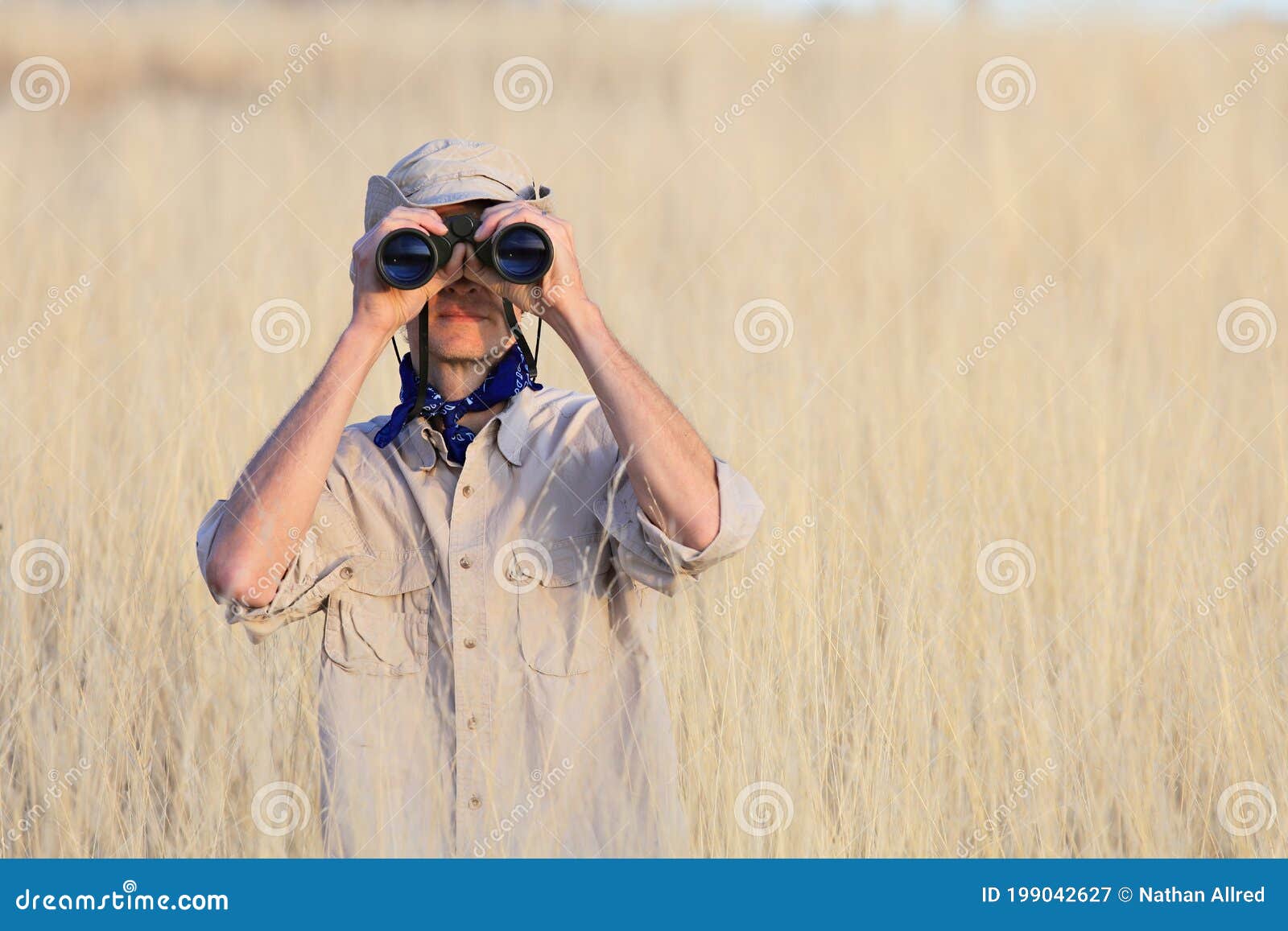 Safari man closeup stock image. Image of savannah, grass - 199042627
