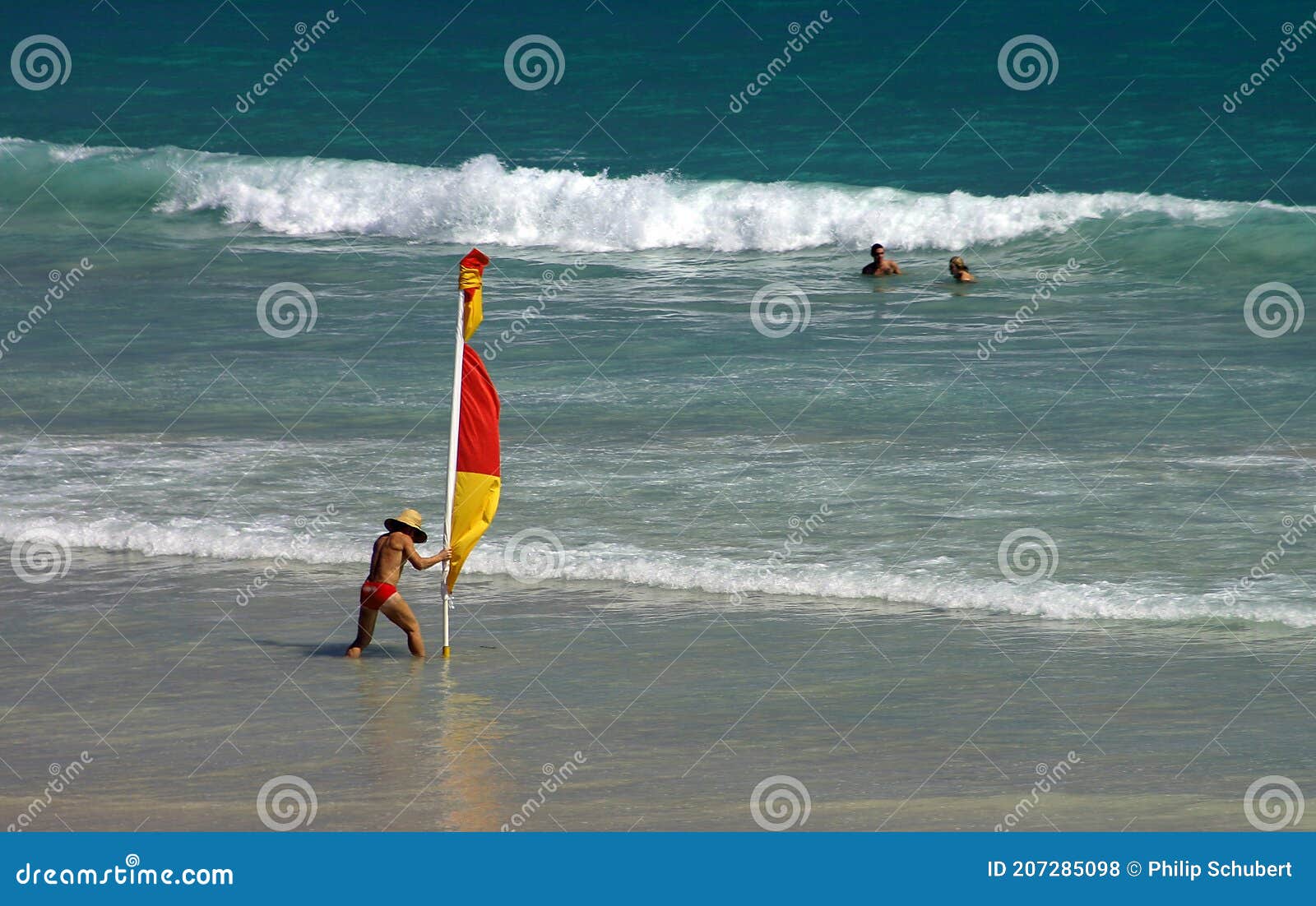 Surf Lifesaver Placing Safety Flag at Cable Beach Stock Photo - Image ...