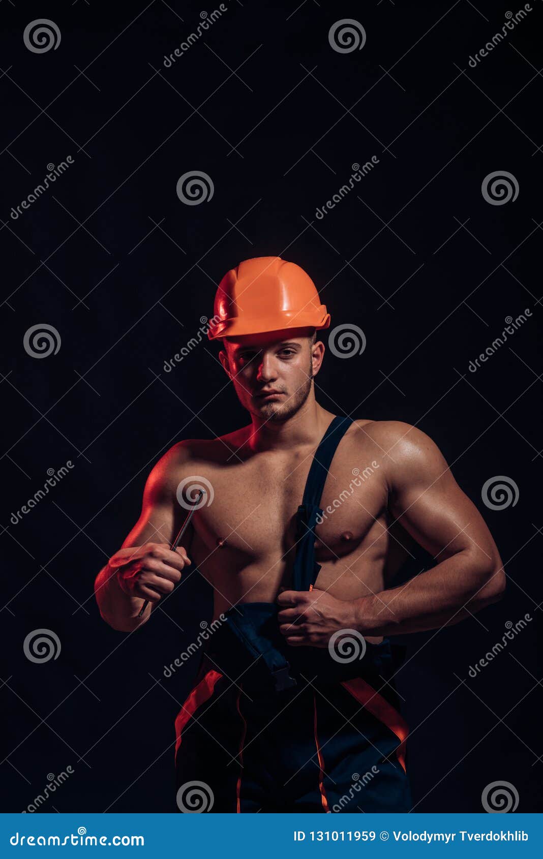 In Safe Keeping. Muscular Man with Nail. Construction Worker or Builder ...