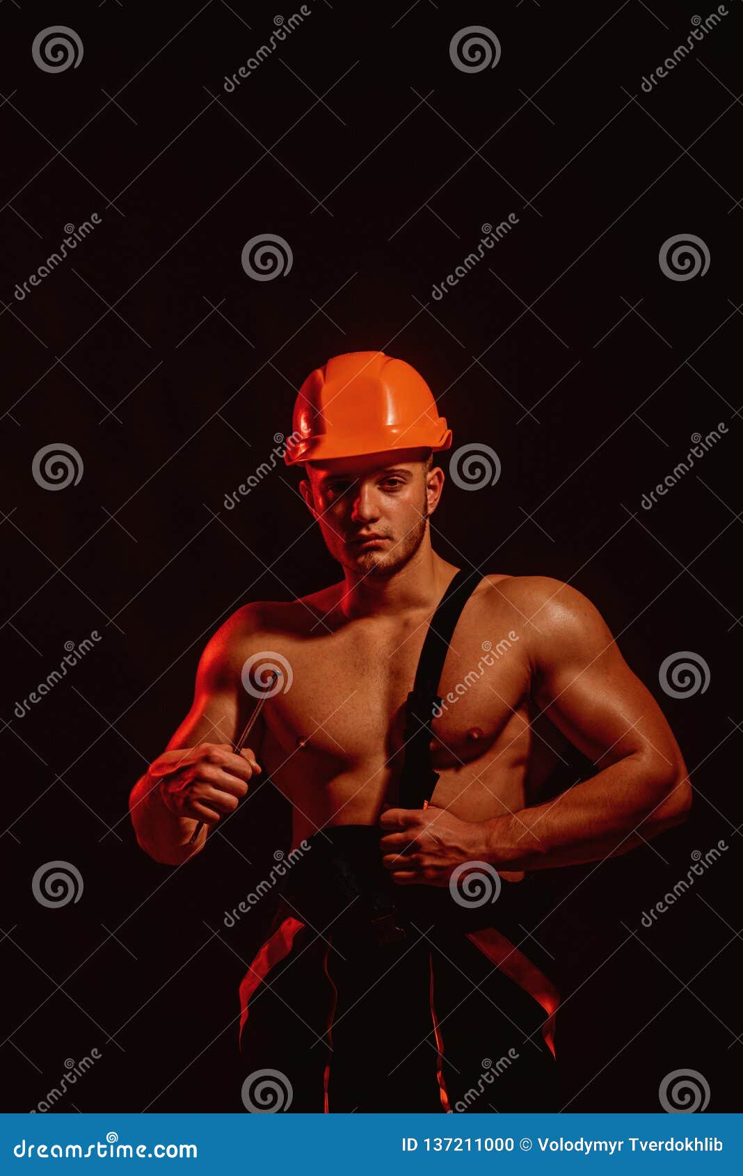 In Safe Keeping. Muscular Man with Nail. Construction Worker or Builder ...