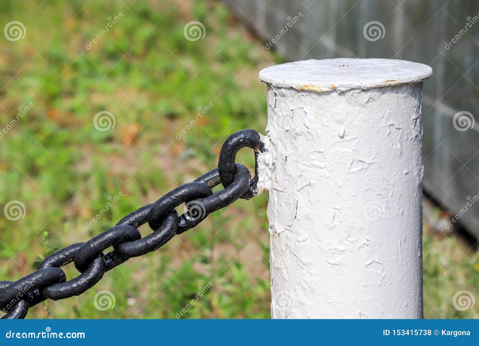 The Safety Bollard with an Eye for Chain and Chain in it Stock Photo ...
