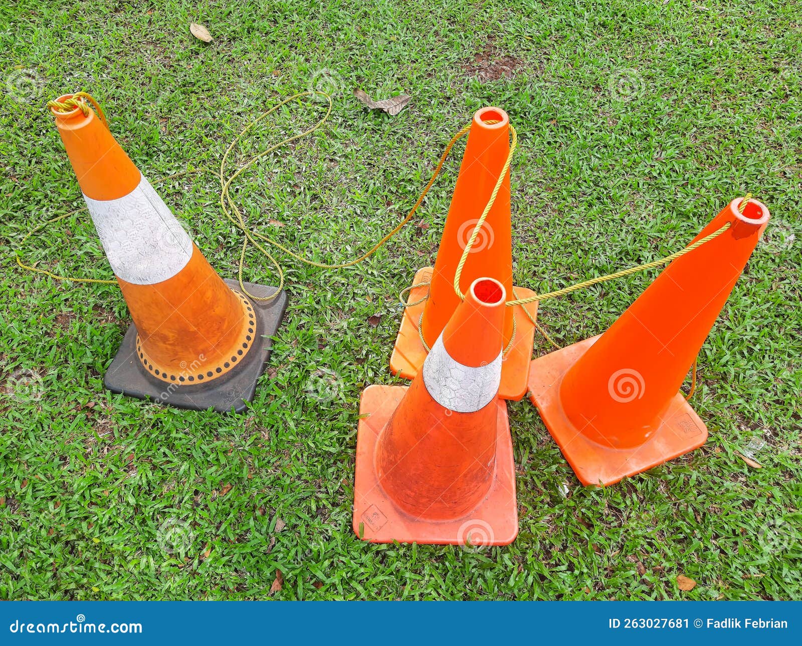 Safety cone on the grass stock image. Image of danger - 263027681