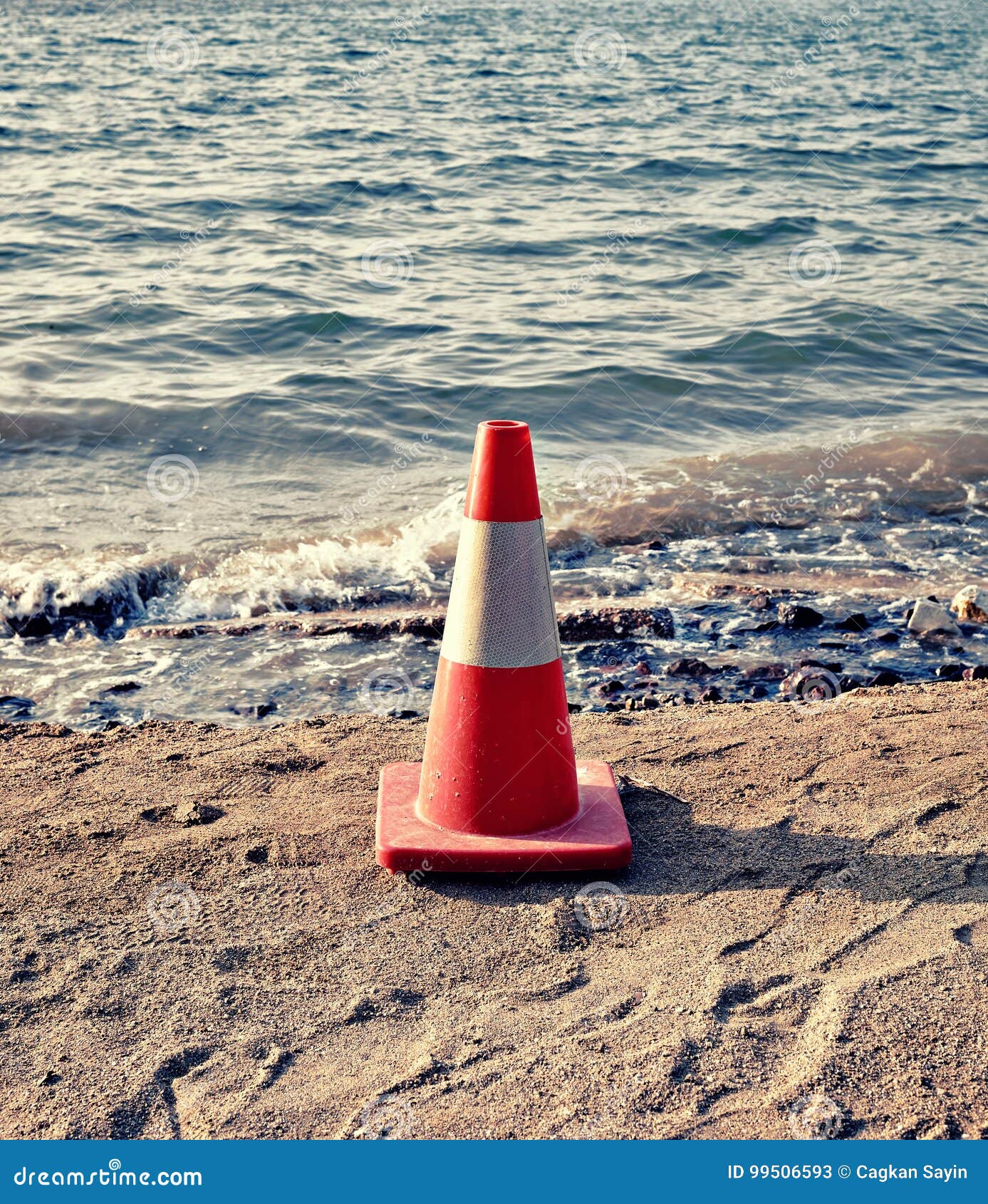 Safety cone on the beach stock image. Image of orange - 99506593