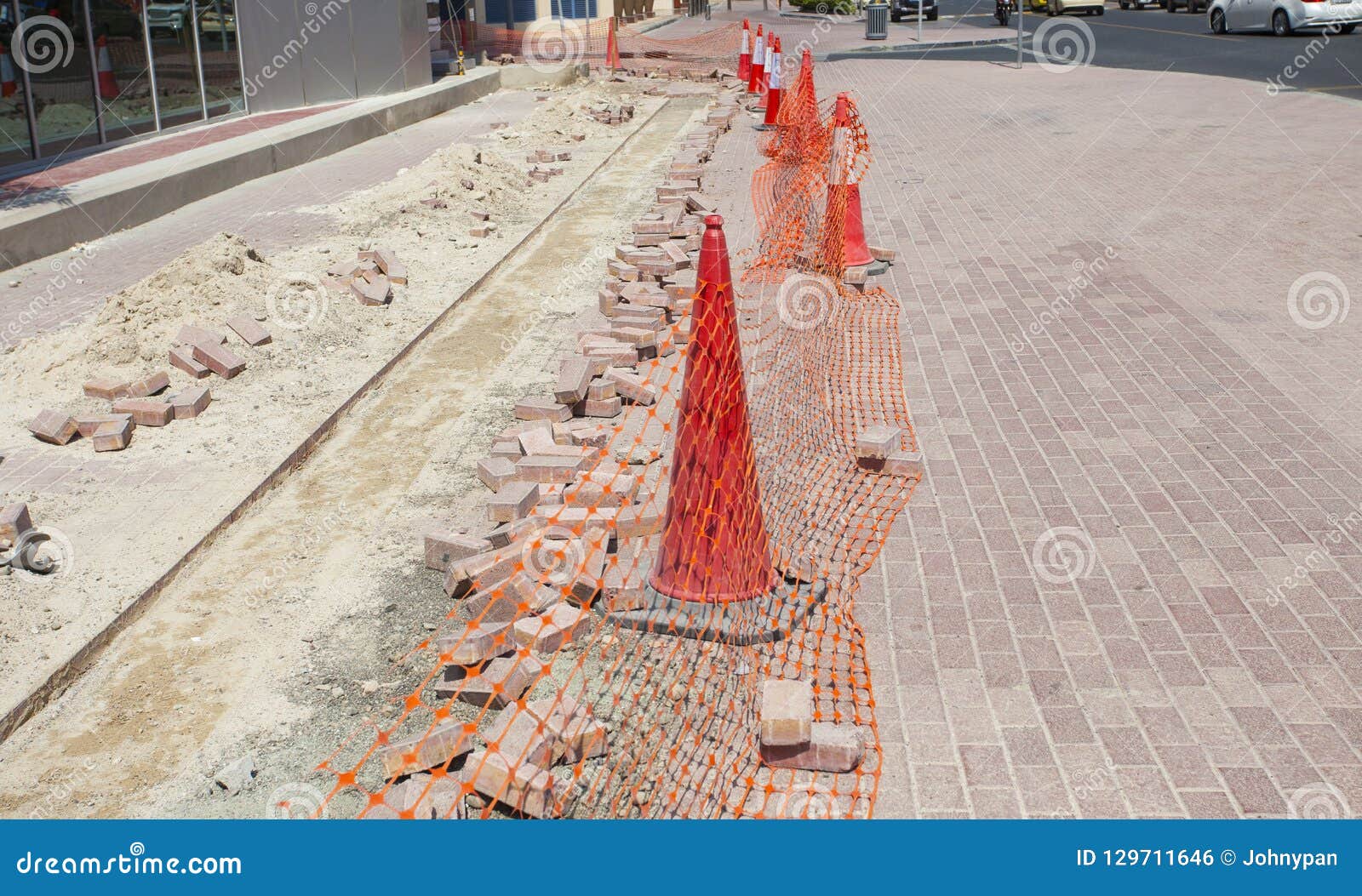 Safety cones in city road stock photo. Image of attention - 129711646