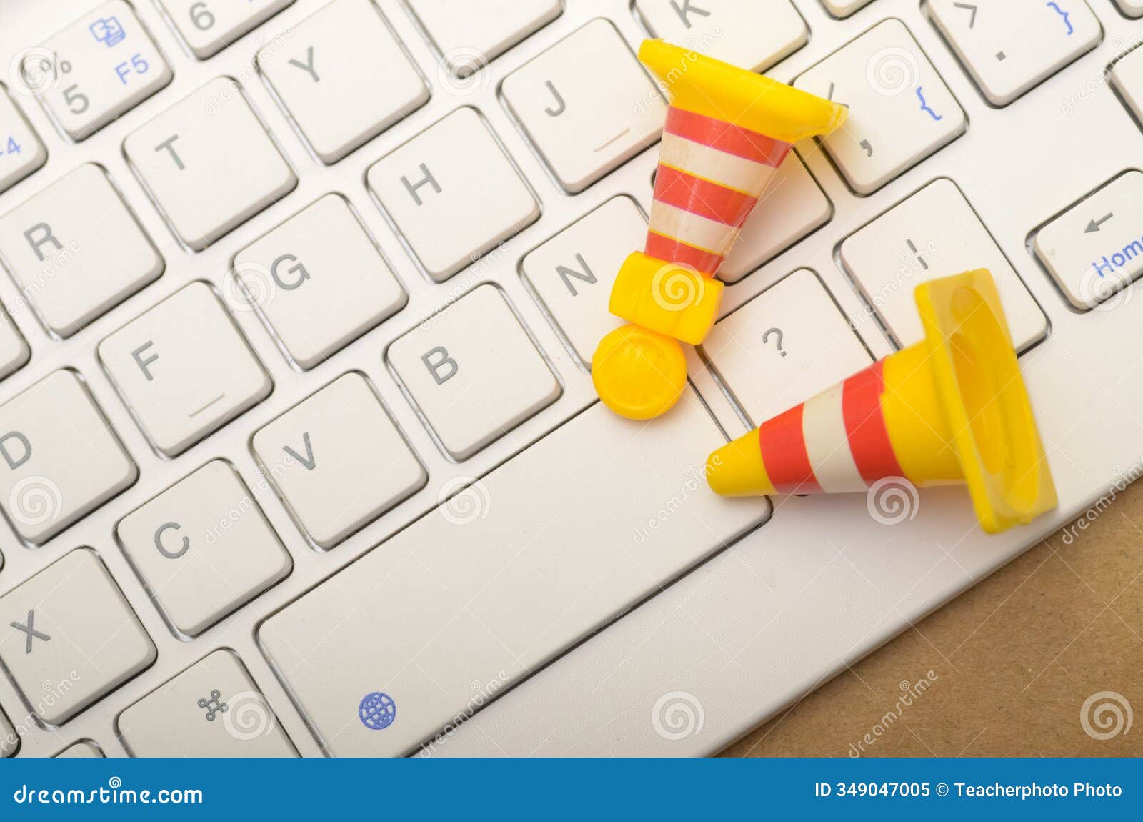 Safety Cones on Keyboard: Symbolizing Caution in Digital Workspaces ...