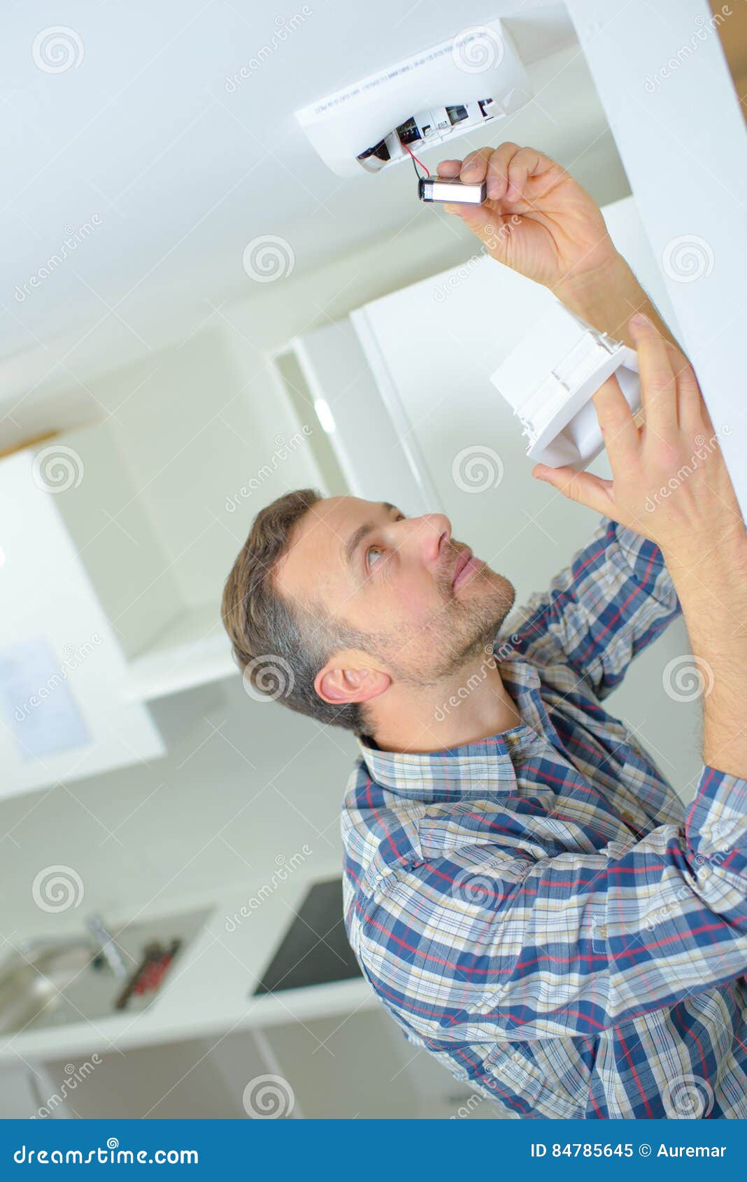 Safety Conscious Man Fitting Fire Smoke Alarm Stock Image - Image of ...