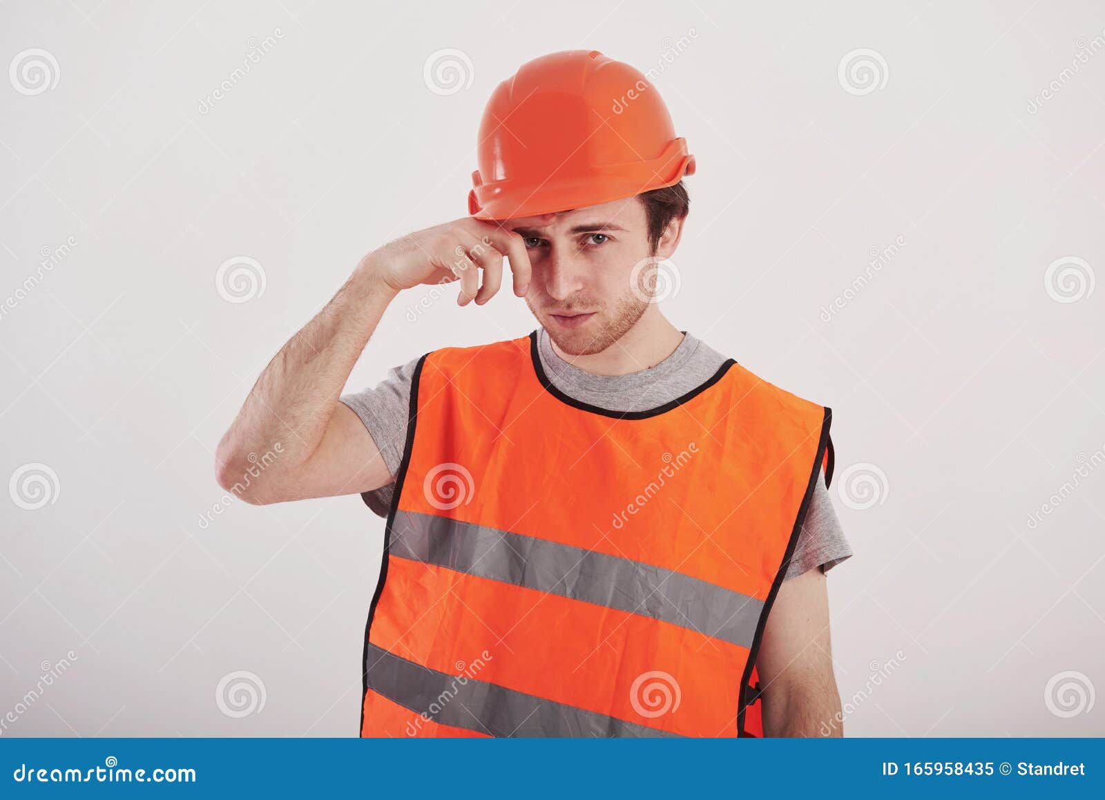 Safety First. Man in Orange Colored Uniform Stands Against White ...