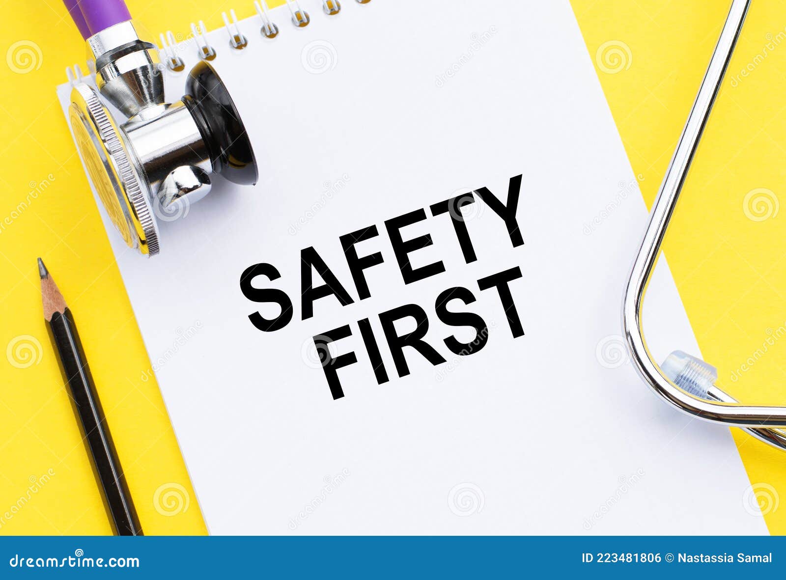 Safety First! Note with Pen and Stethoscope on Yellow Background Stock ...