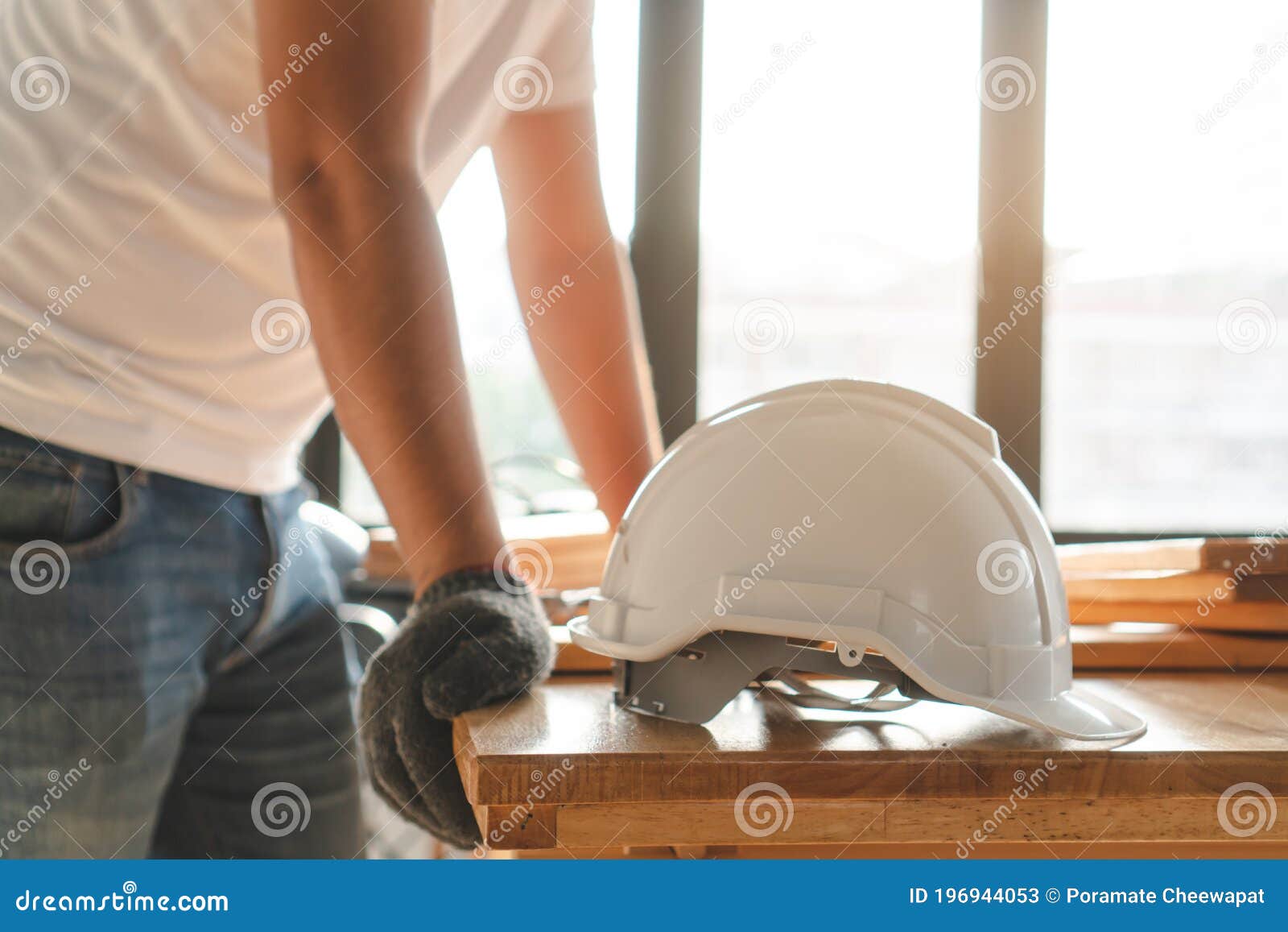 Safety Hard Hat on the Table and Worker As Background Stock Image ...