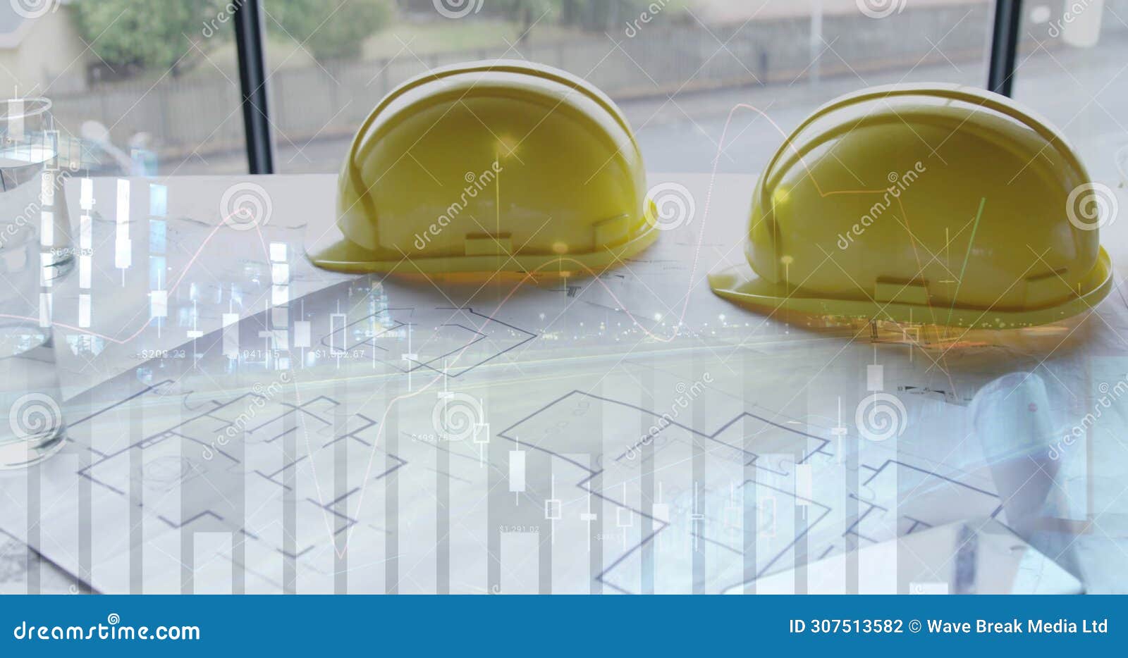 Safety Hats on Building Plans Laid Out on a Table Stock Photo - Image ...