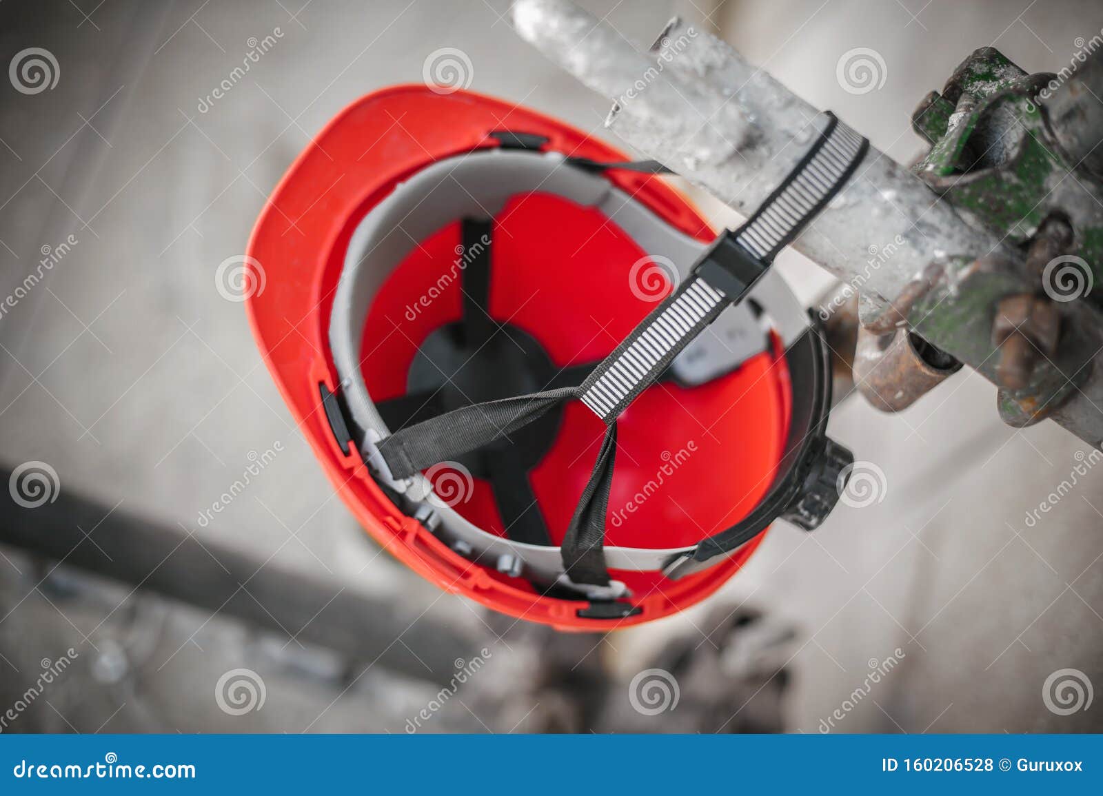 Safety Helmet in Construction Site with Scaffolding and Working Tools ...