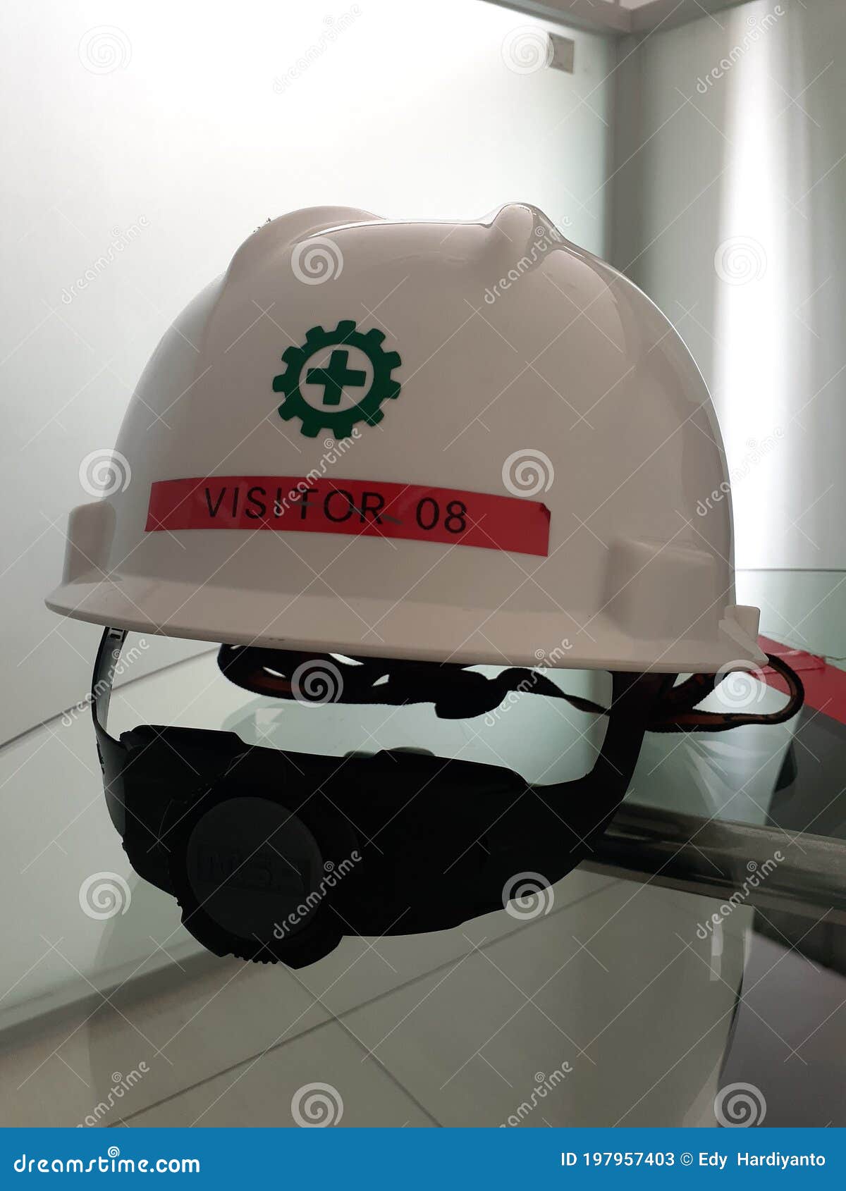 Safety helmet for visitor stock image. Image of site - 197957403