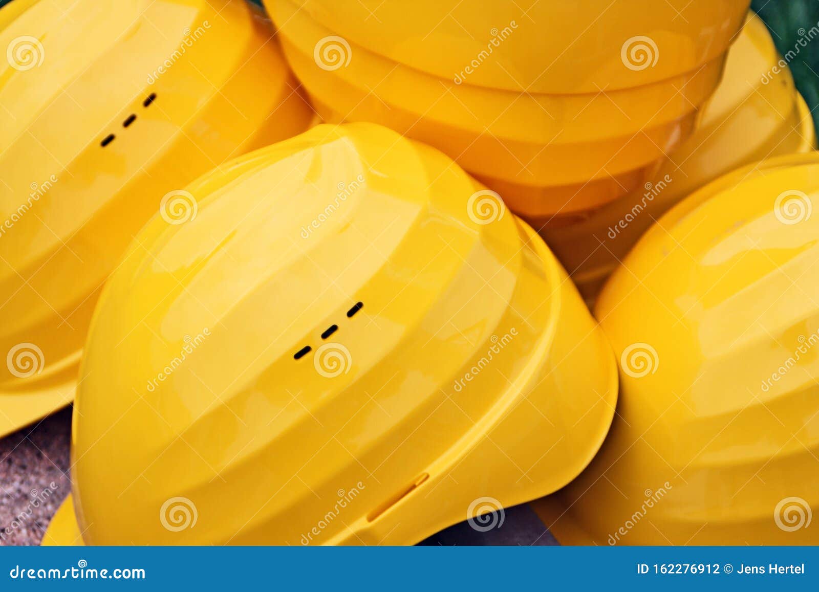 Yellow Safety Helmets on a Construction Site Stock Photo - Image of ...