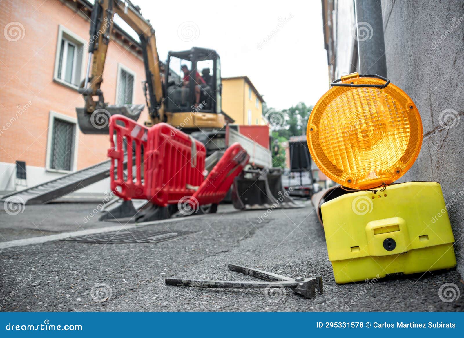 Safety Lantern on Construction Work with Red Barriers and Excavator ...