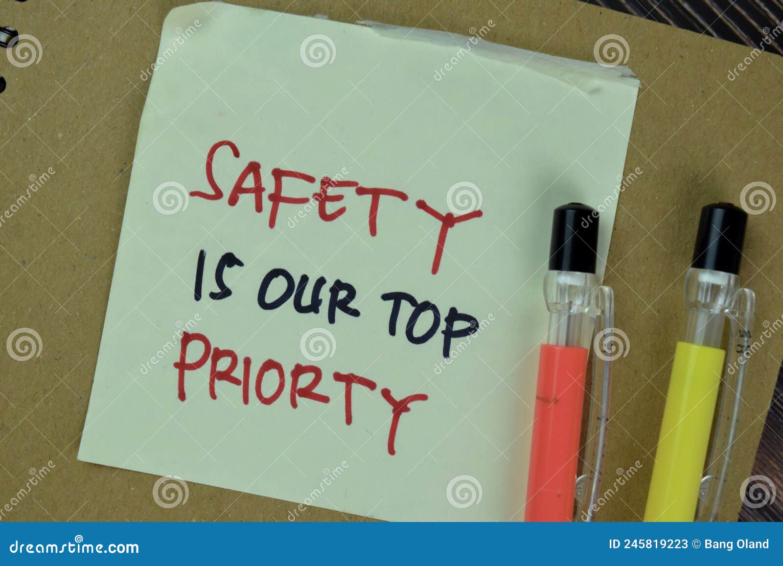 Safety is Our Top Priority Write on Sticky Notes Isolated on Wooden ...