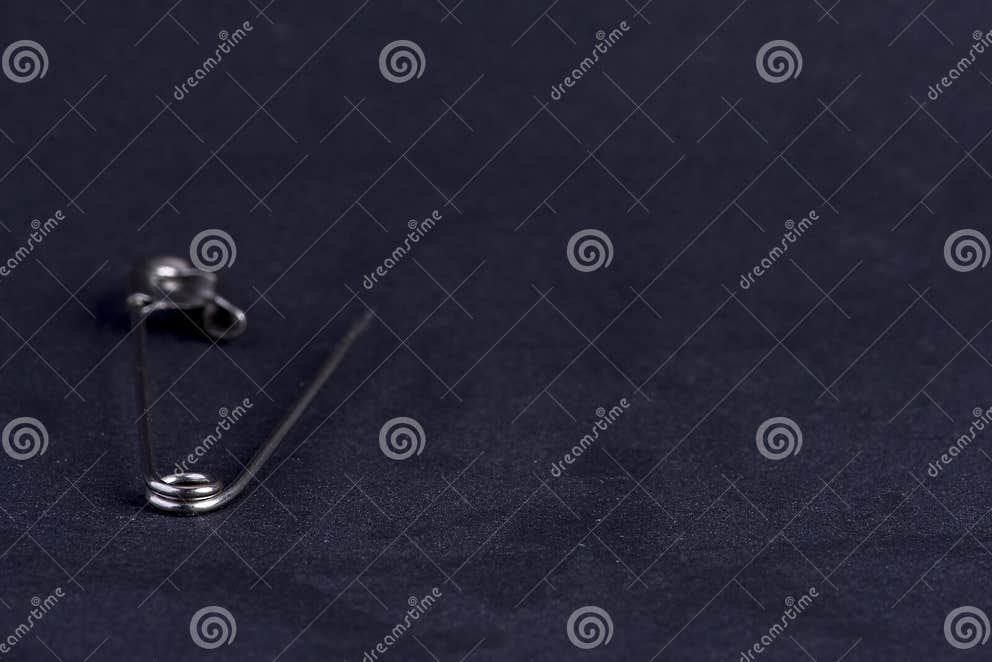 Safety Pin on Black Background with Text Space Stock Photo - Image of ...