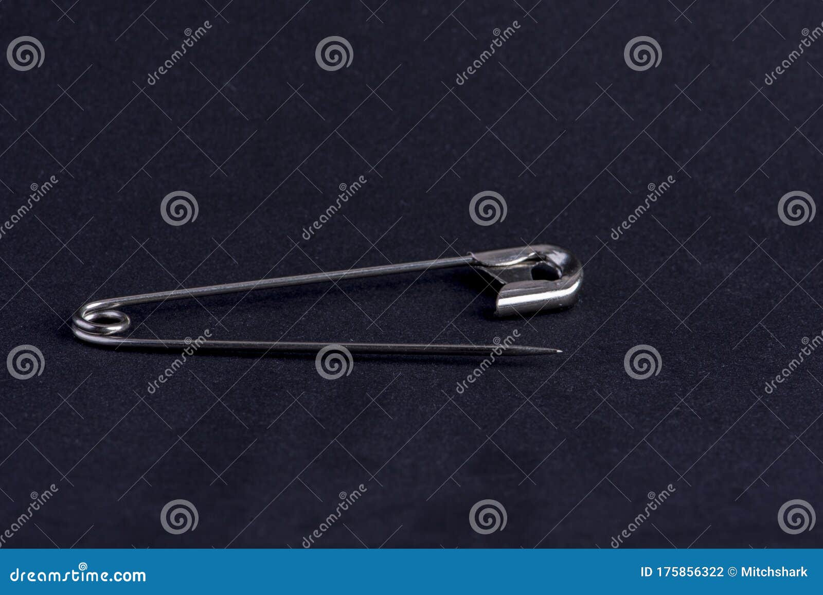 Safety Pin on Black Background with Text Space Stock Photo - Image of ...
