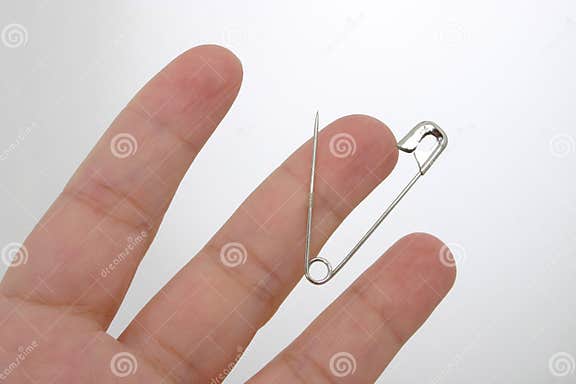 Safety Pin Stuck in Finger stock photo. Image of silver - 46150