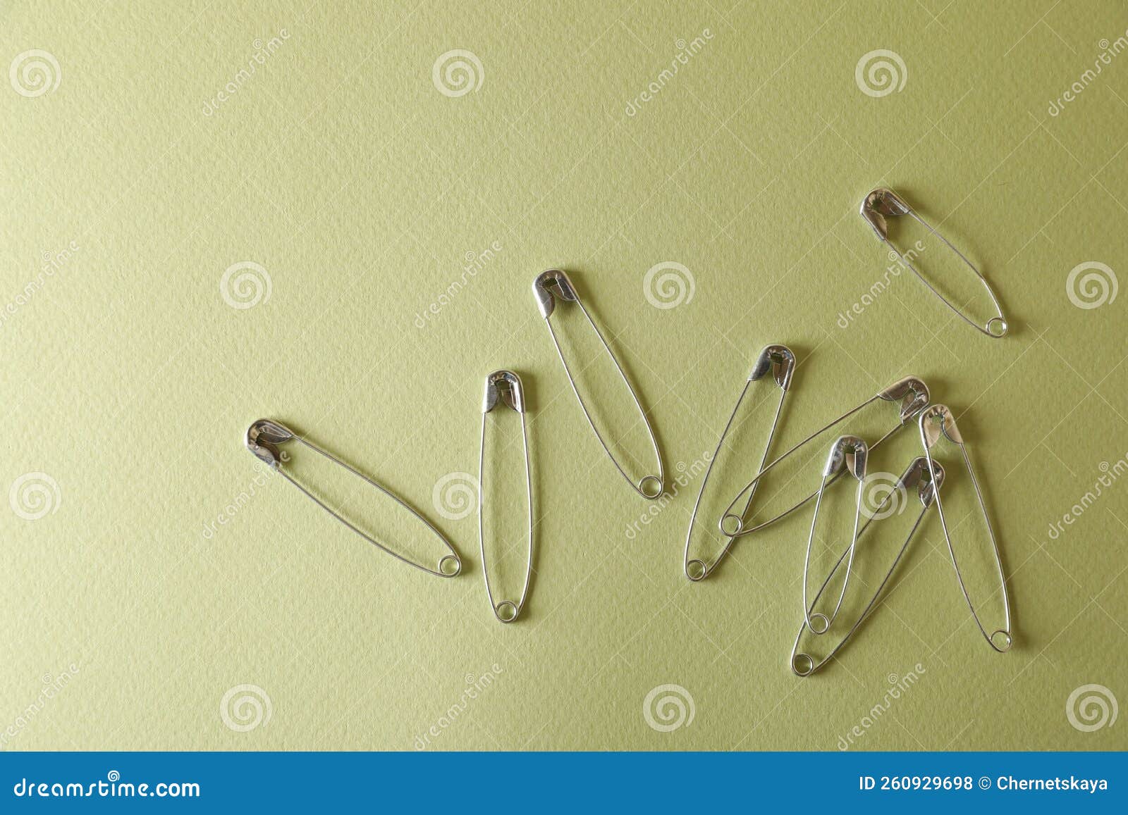 Safety Pins on Green Background, Flat Lay. Space for Text Stock Photo ...
