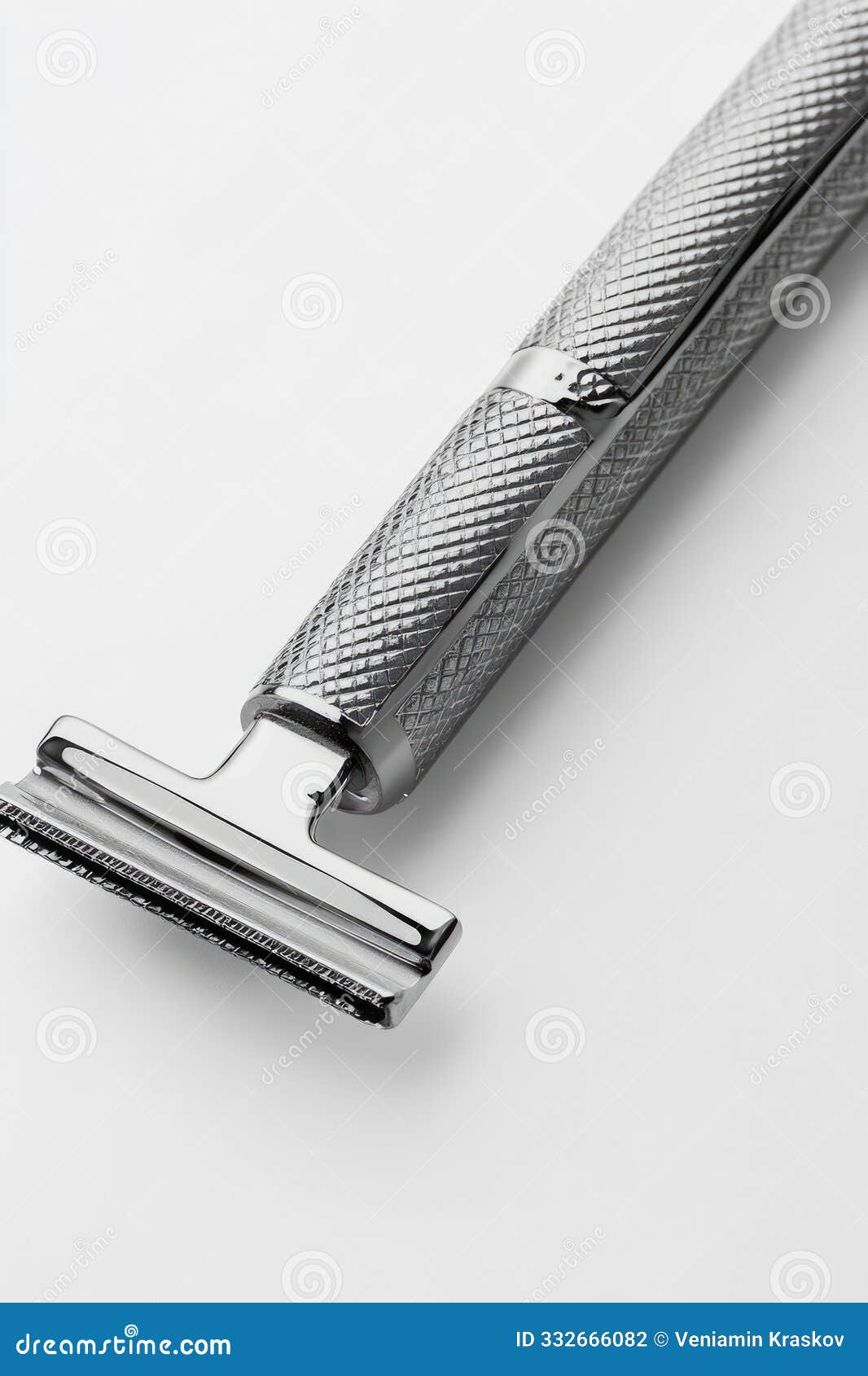 A Safety Razor with a Metallic Handle and Blade, Isolated on a White ...