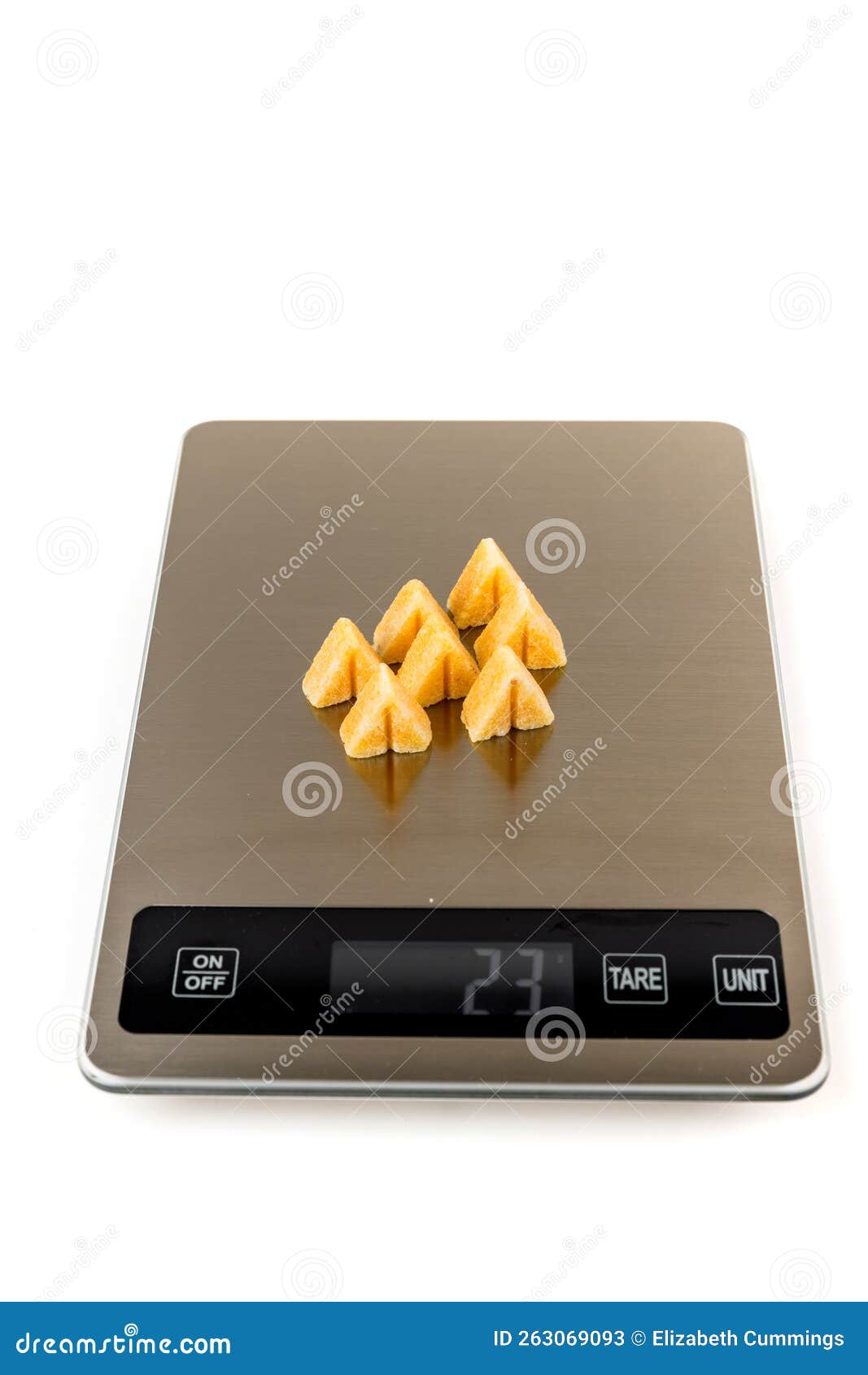Saffron Spiced Sugar Seven Cubes on a Scale Over White Stock Image ...